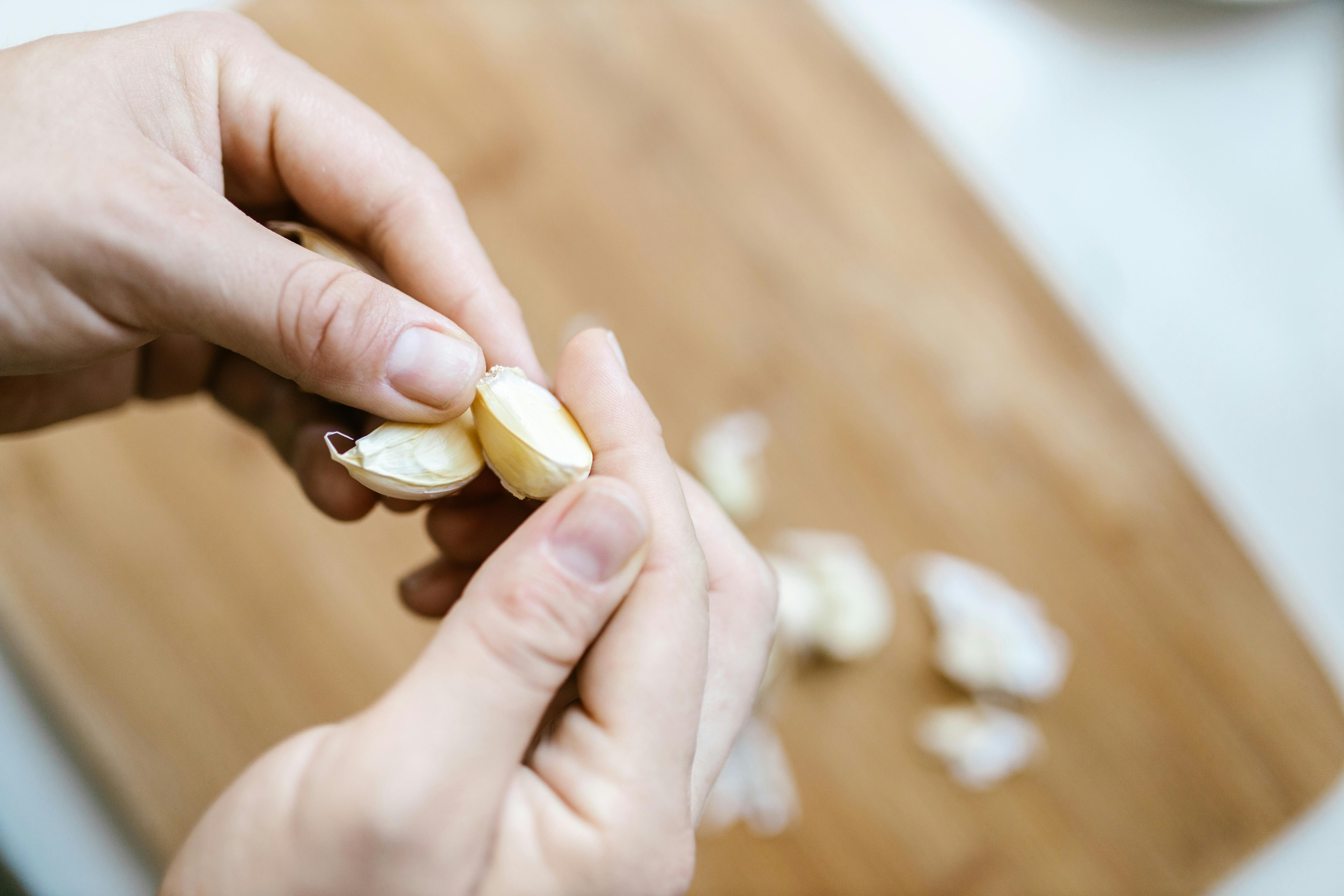 Hands Holding Garlic · Free Stock Photo