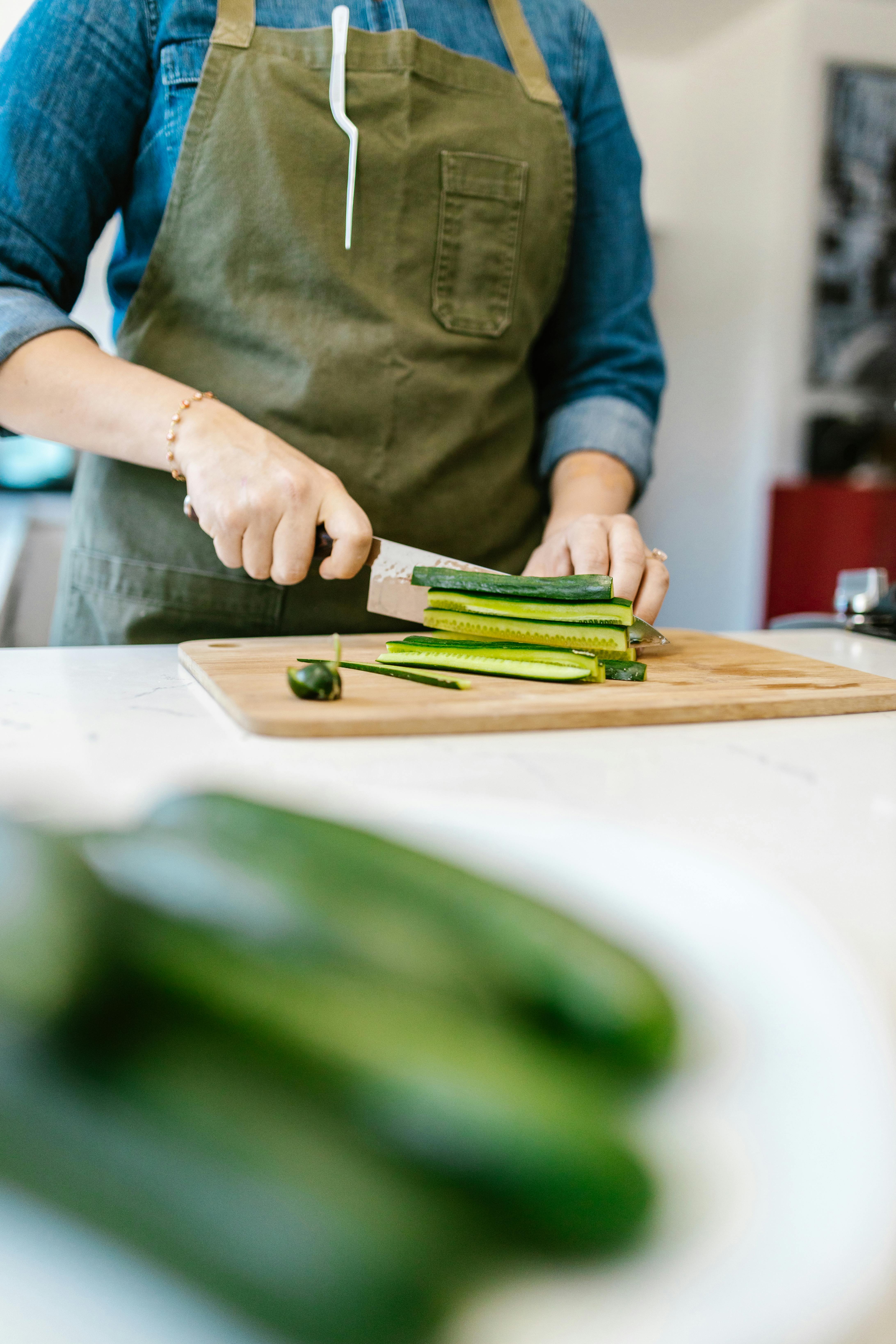 Woman Cutting Cucumber · Free Stock Photo