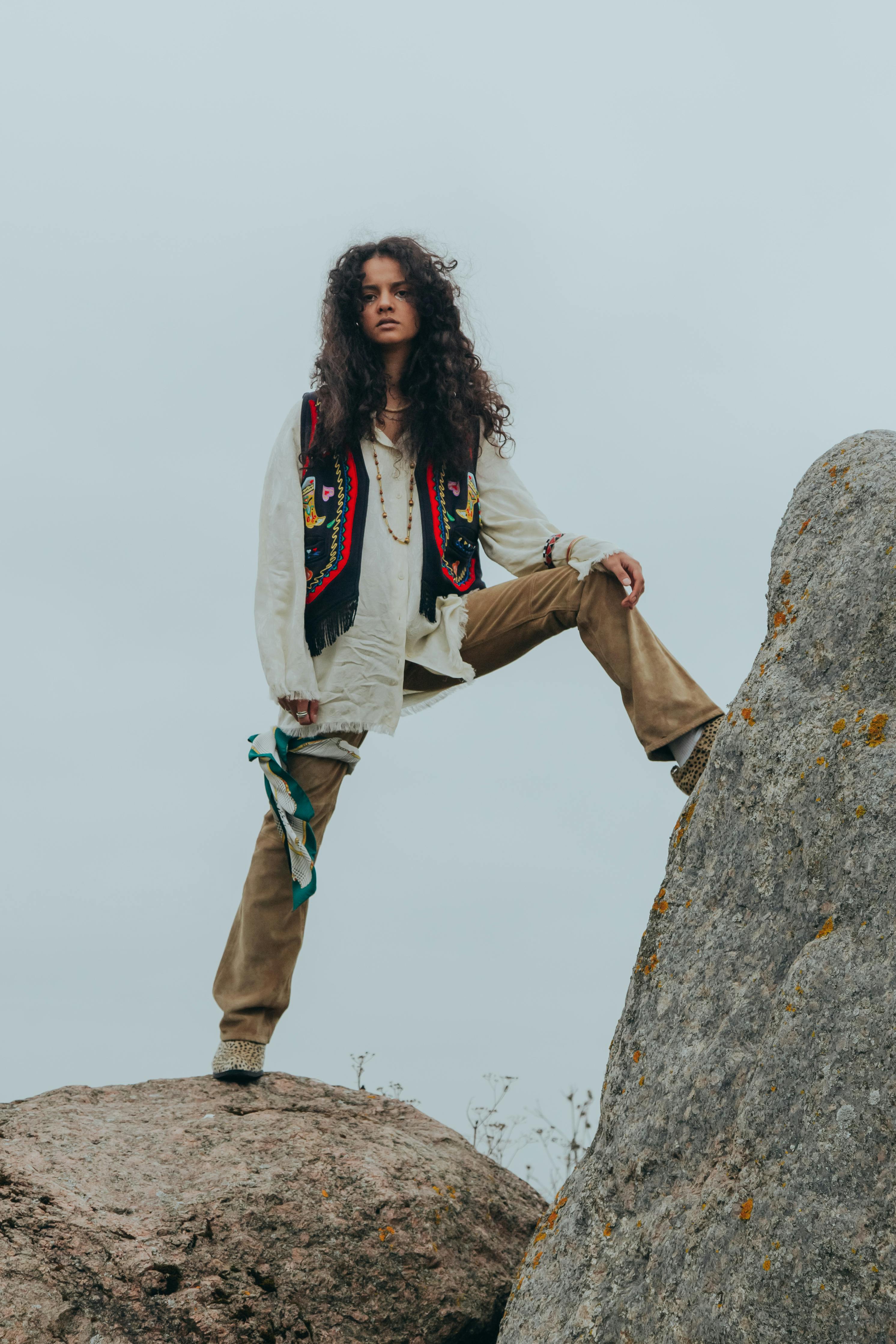 Person Standing on a Rock · Free Stock Photo