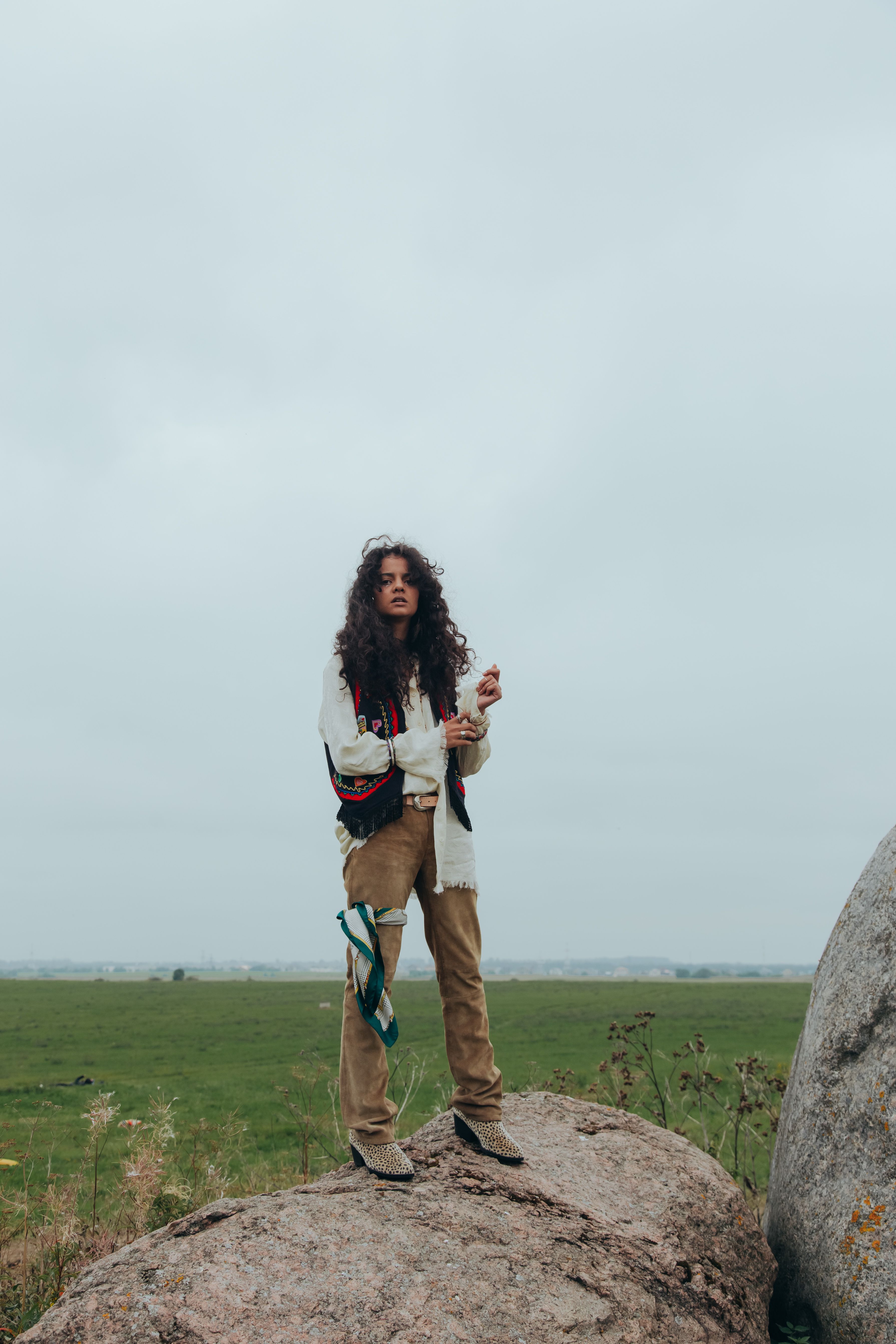 Person Sitting on Rock · Free Stock Photo