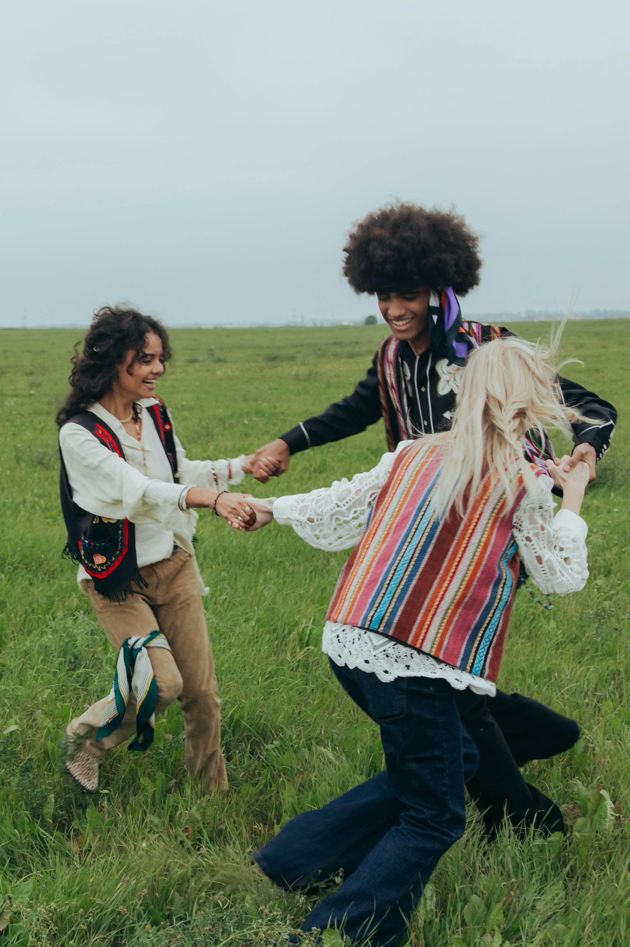 A Groupo Friends Playing in the Grass Field · Free Stock Photo