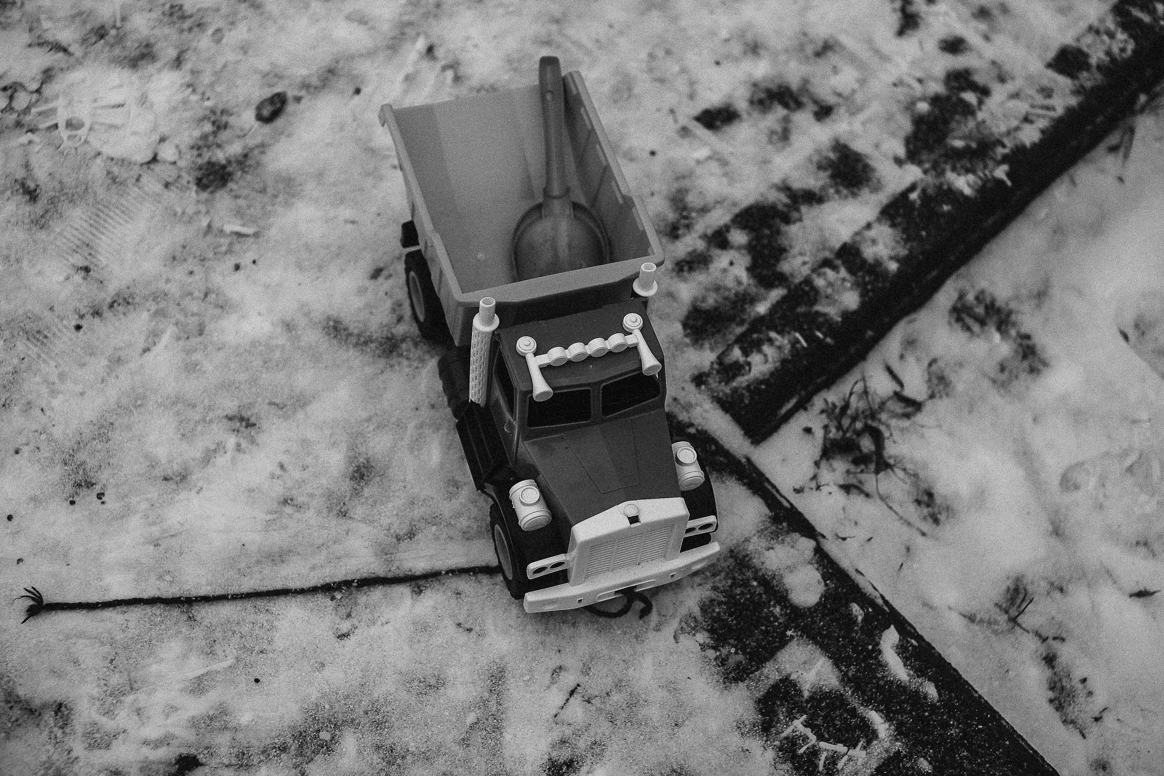 Grayscale Photo of a Toy Truck · Free Stock Photo