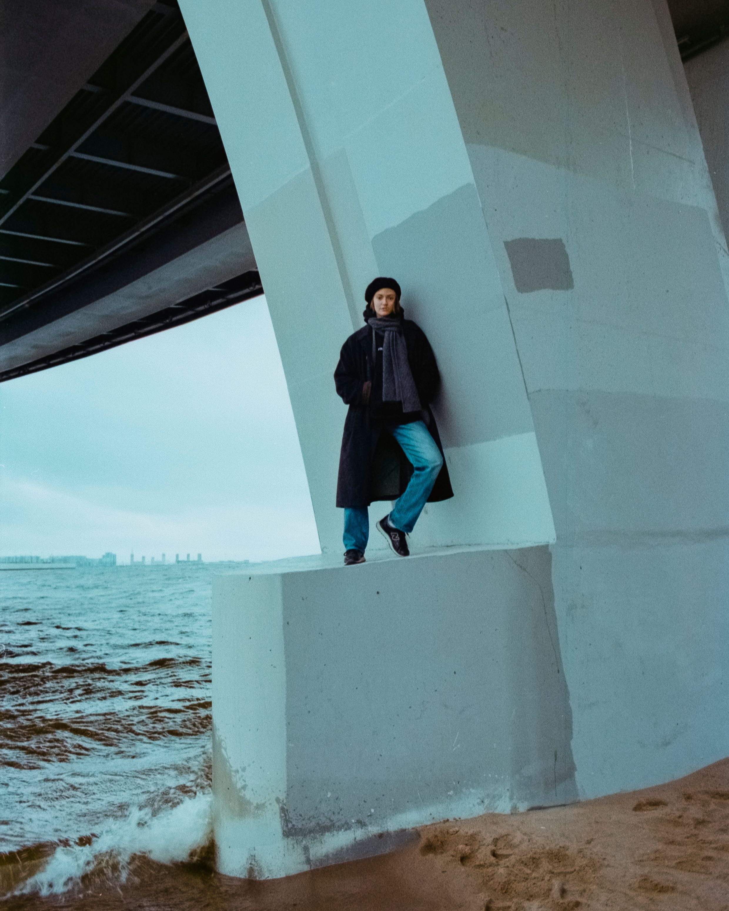 Woman Standing by Bridge Pillar · Free Stock Photo