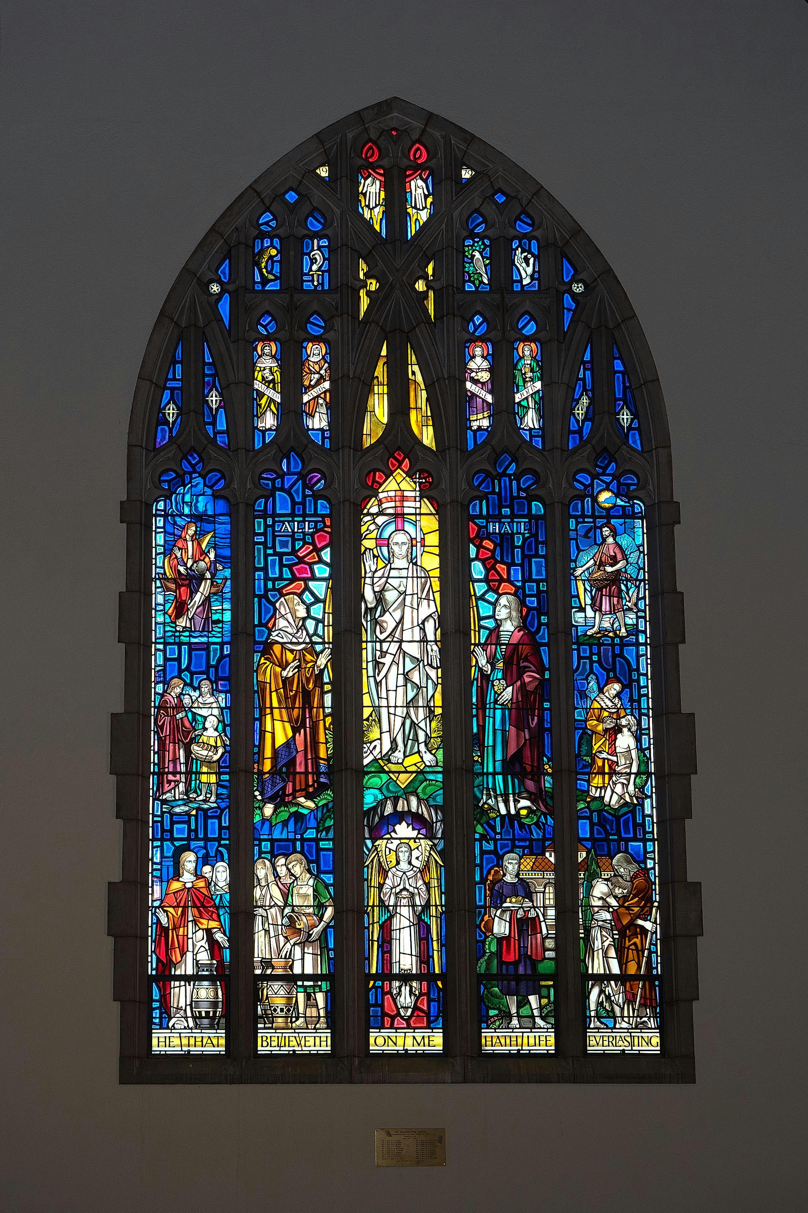 A Beautiful Stained Glass on a White Wall · Free Stock Photo