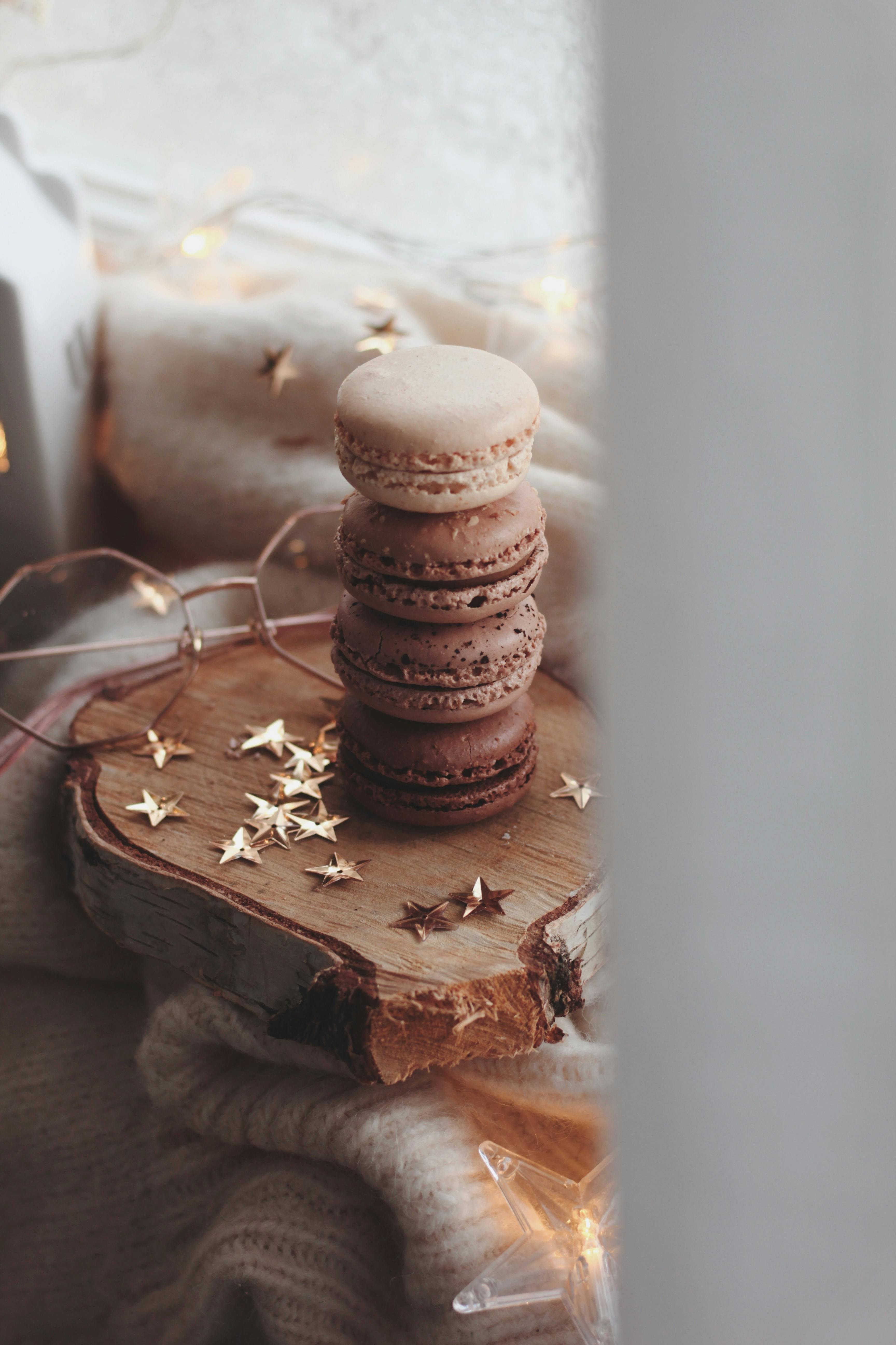 Macaroons Stacked on a Wooden Board · Free Stock Photo