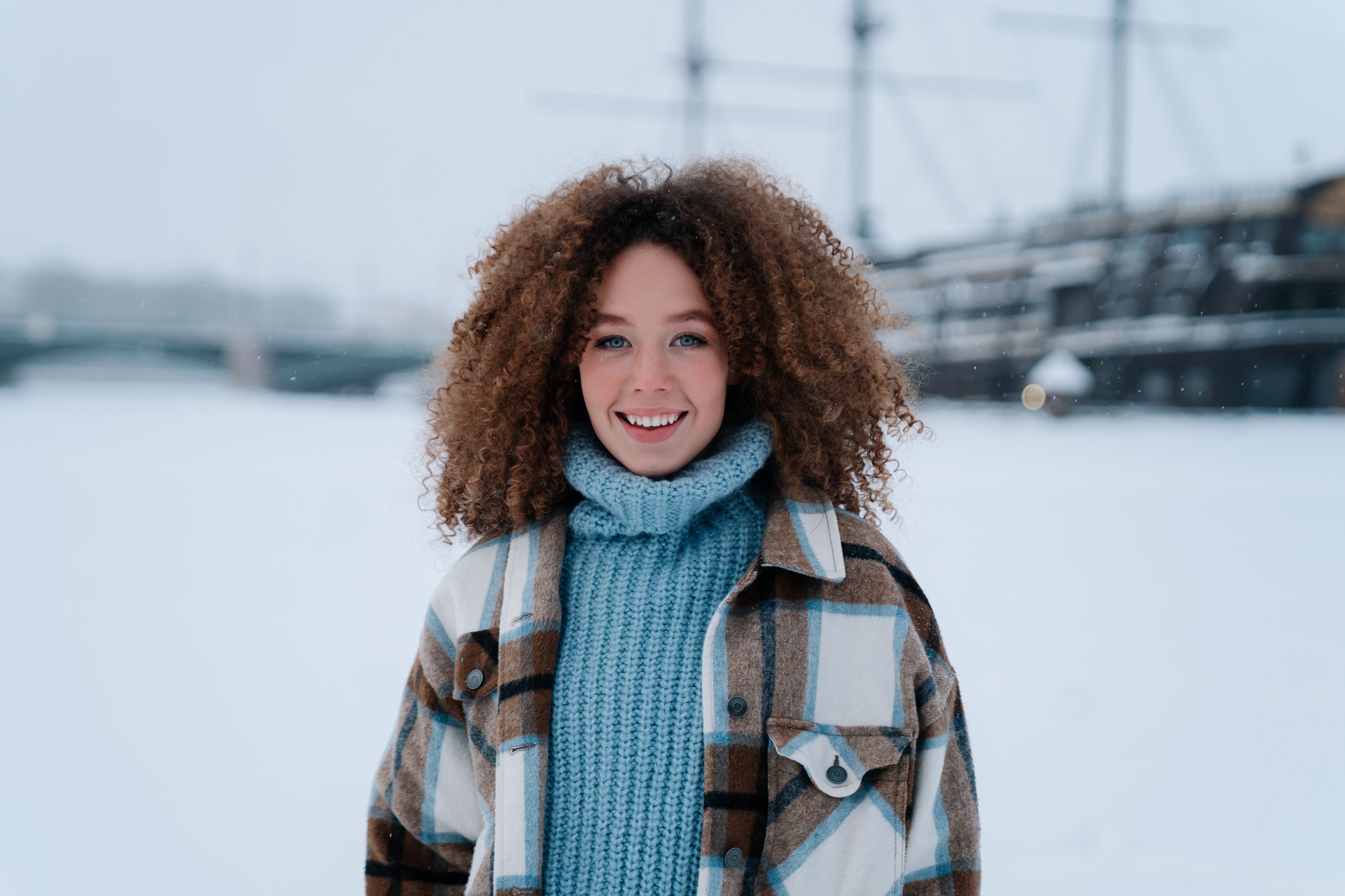 Portrait if Woman in Snow Field Smiling at Camera · Free Stock Photo