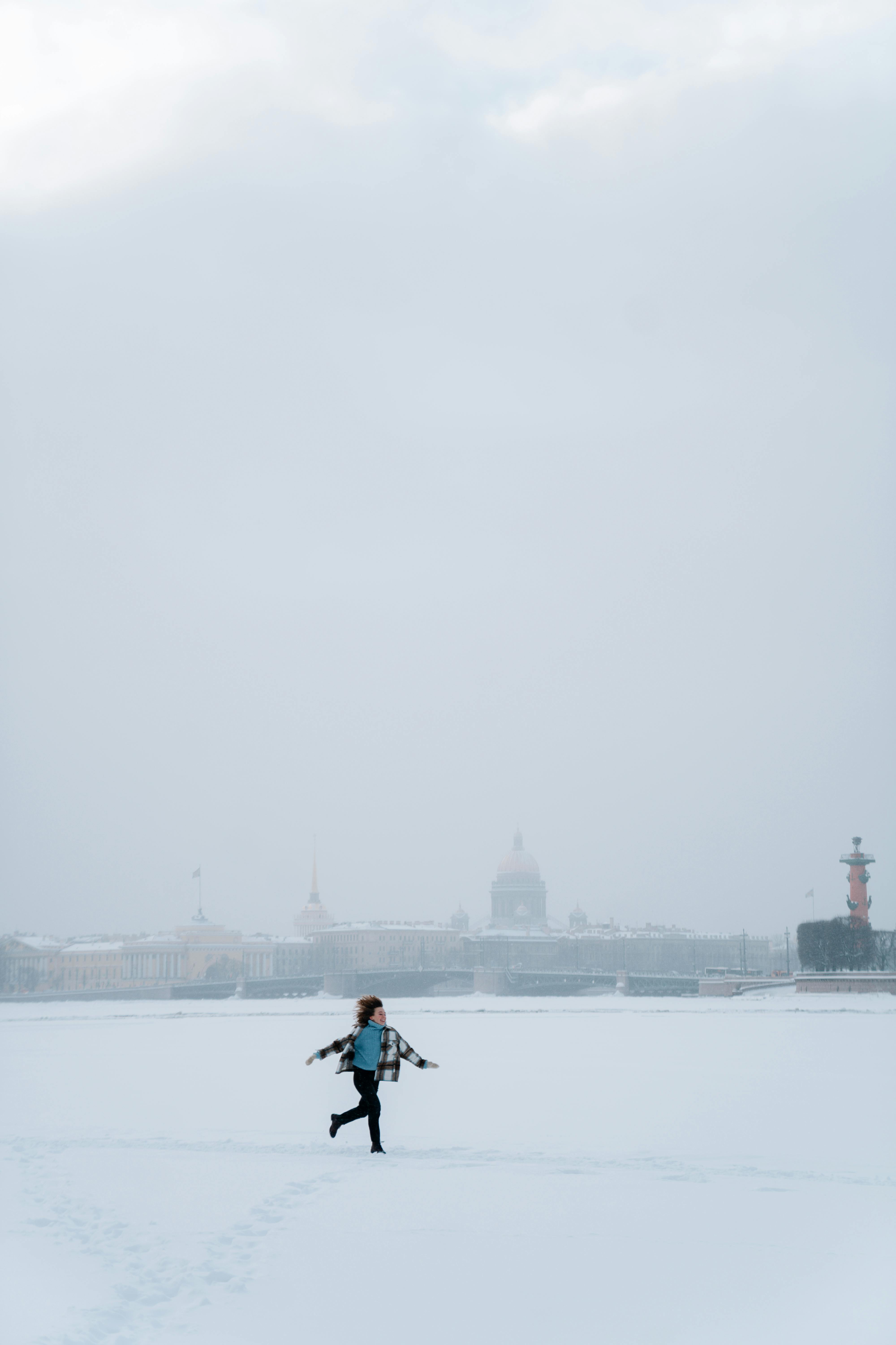 Woman Running Through Snow · Free Stock Photo
