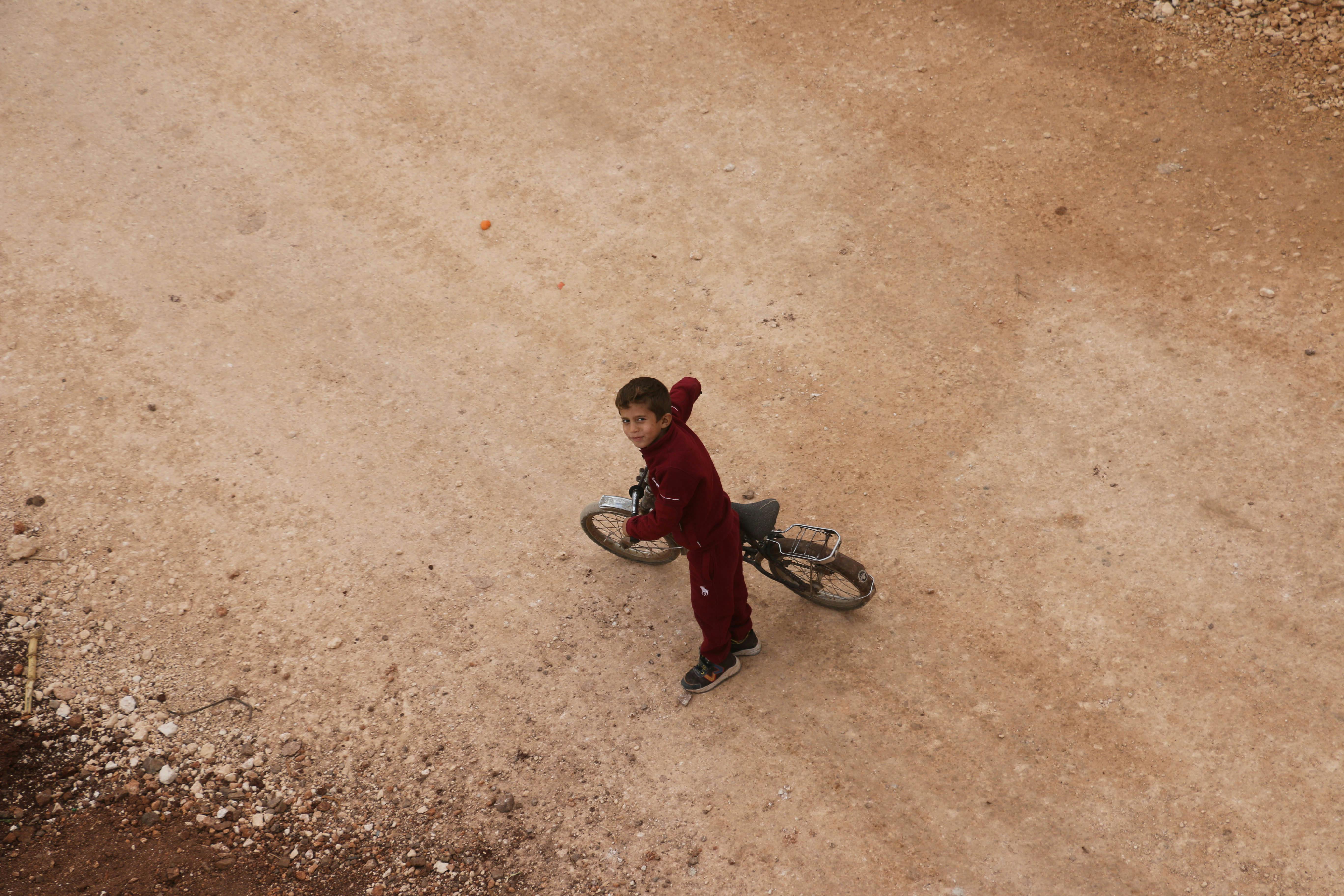 Photo of Boy Riding a Bike · Free Stock Photo