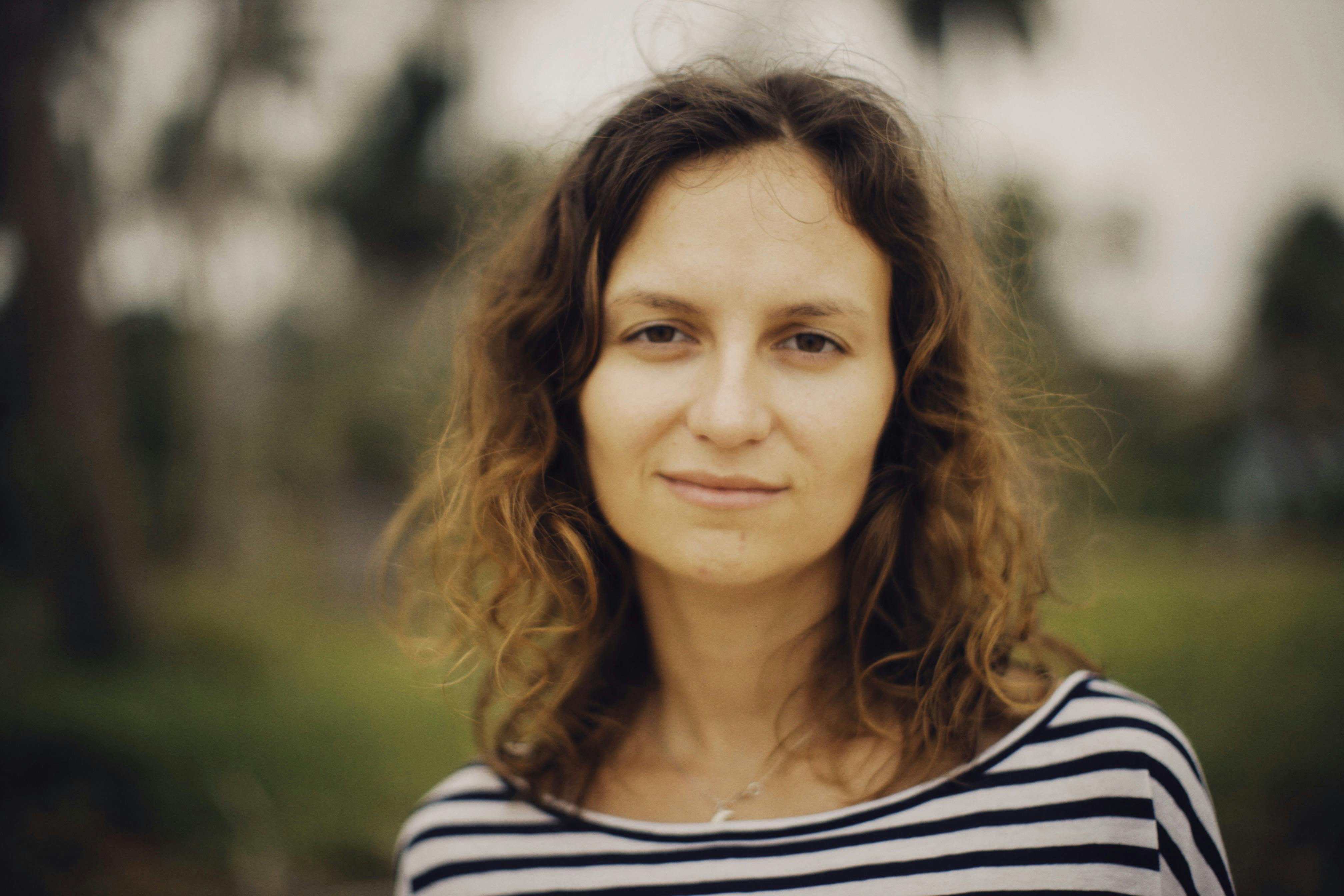 Woman Smiling Gently · Free Stock Photo