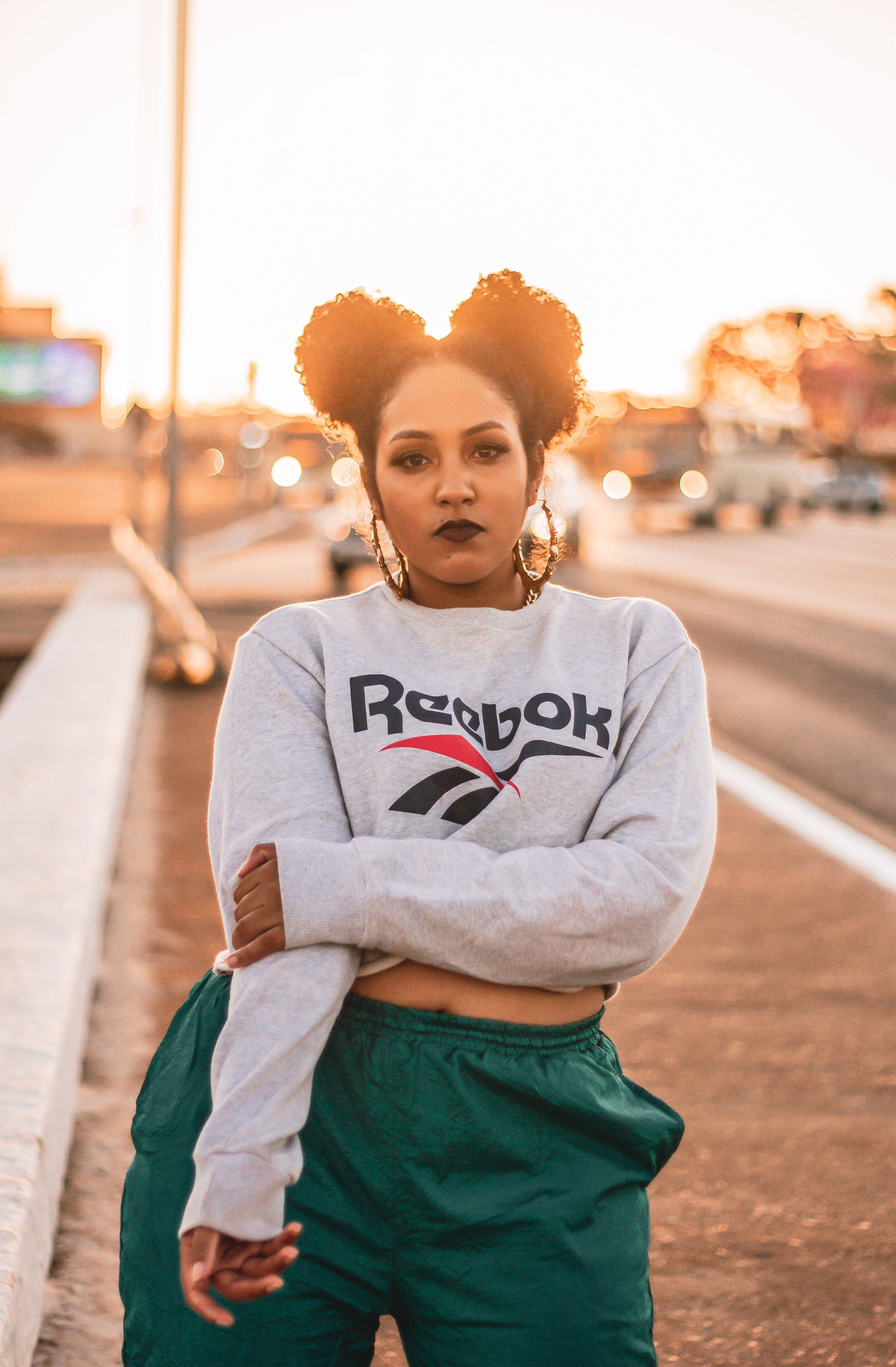 Portrait of a Young Woman on a Roadside · Free Stock Photo