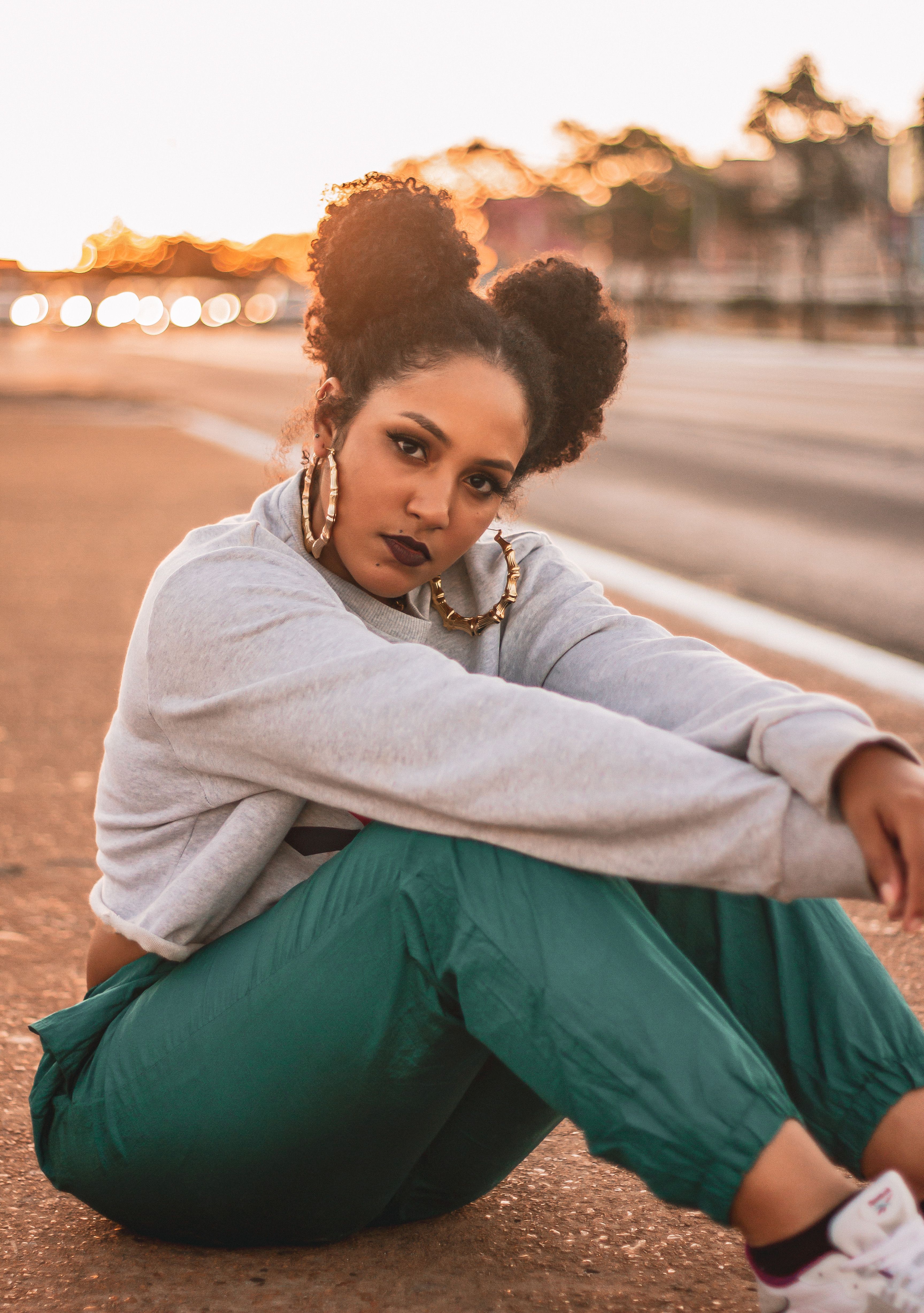 Fashion Model Girl Sitting on Road · Free Stock Photo