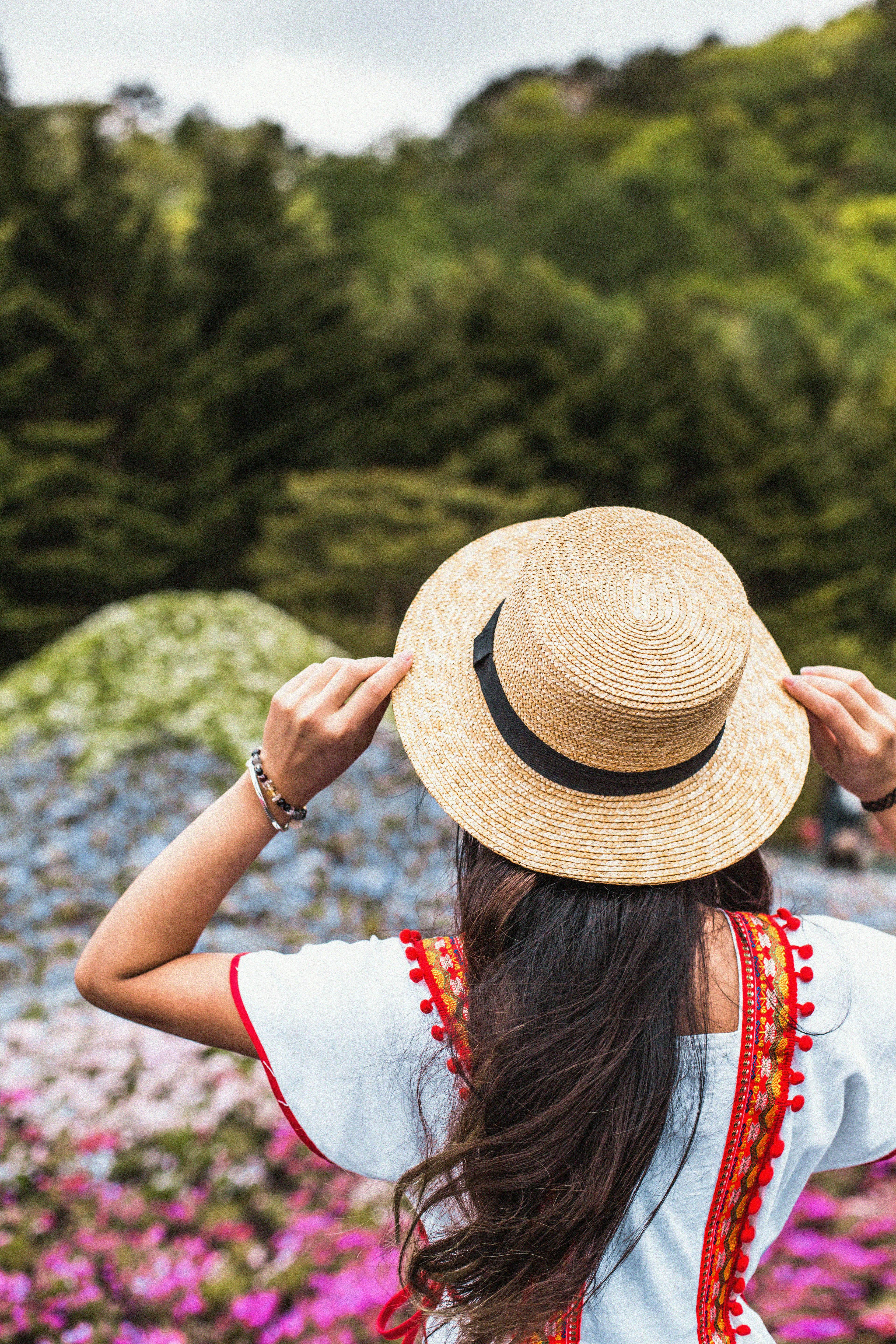 Backside of a Woman Wearing a Hat · Free Stock Photo