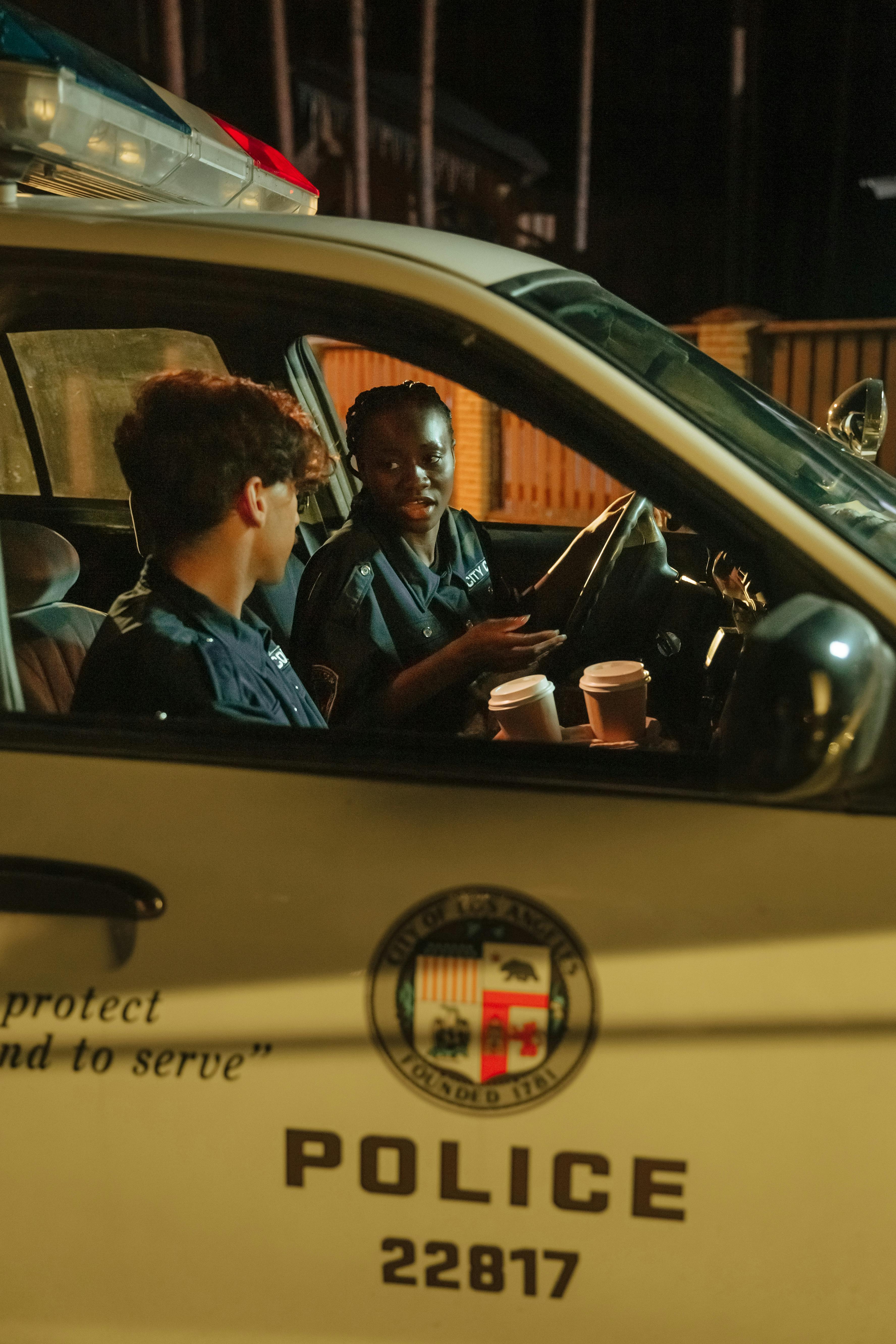 Cops Sitting Inside a Police Car · Free Stock Photo