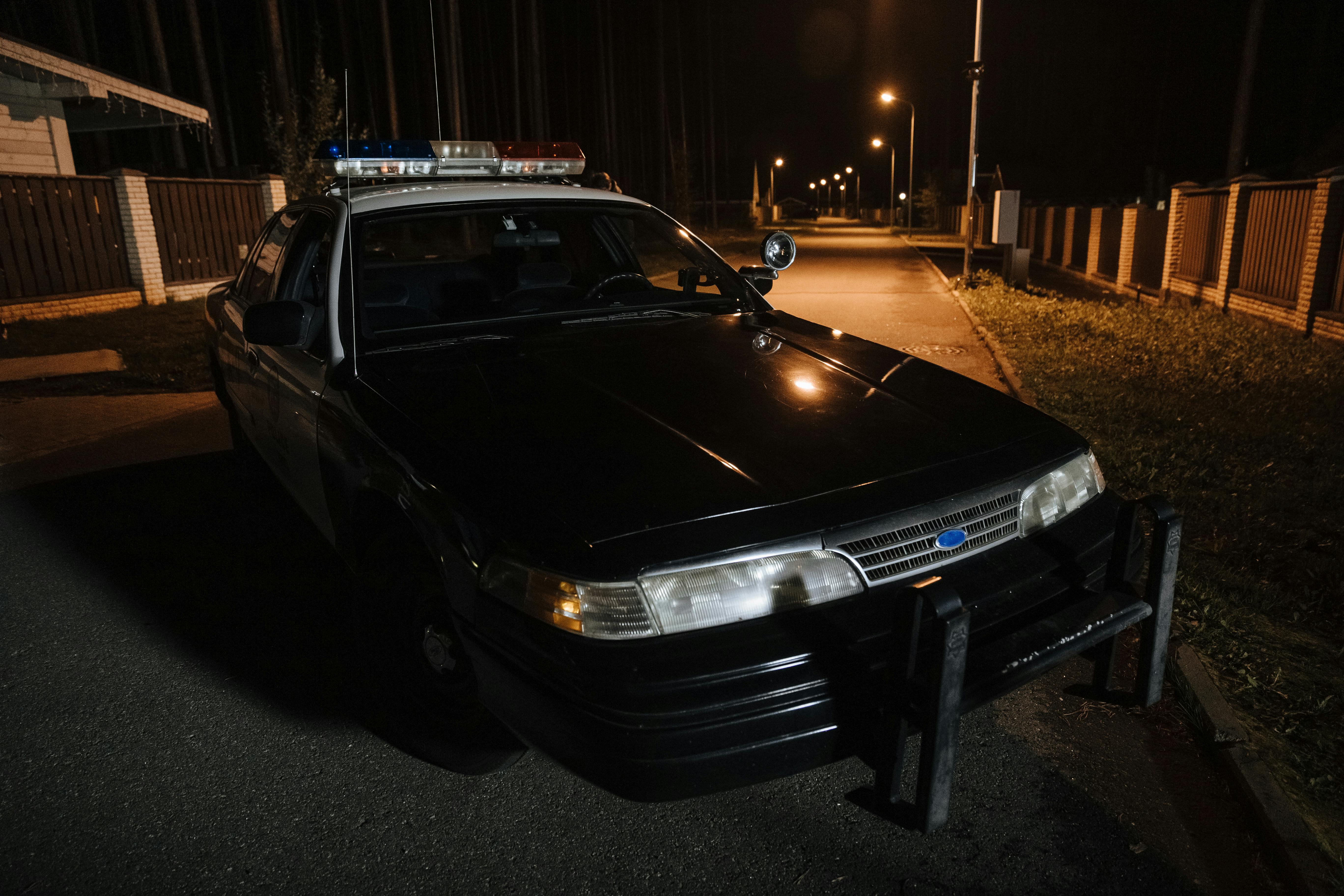 Police Car Parked Near Building · Free Stock Photo