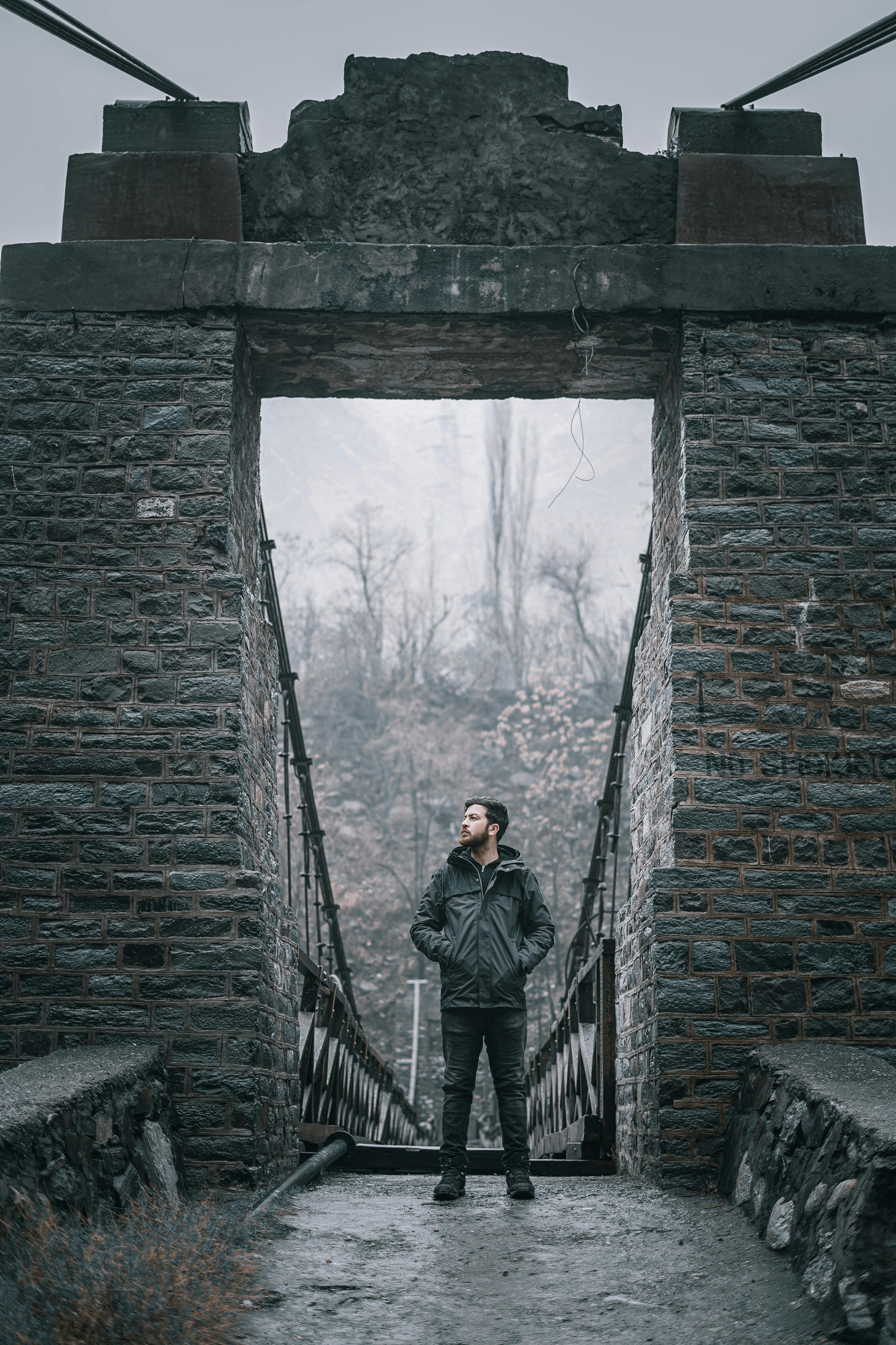 Man Posing in Gate · Free Stock Photo