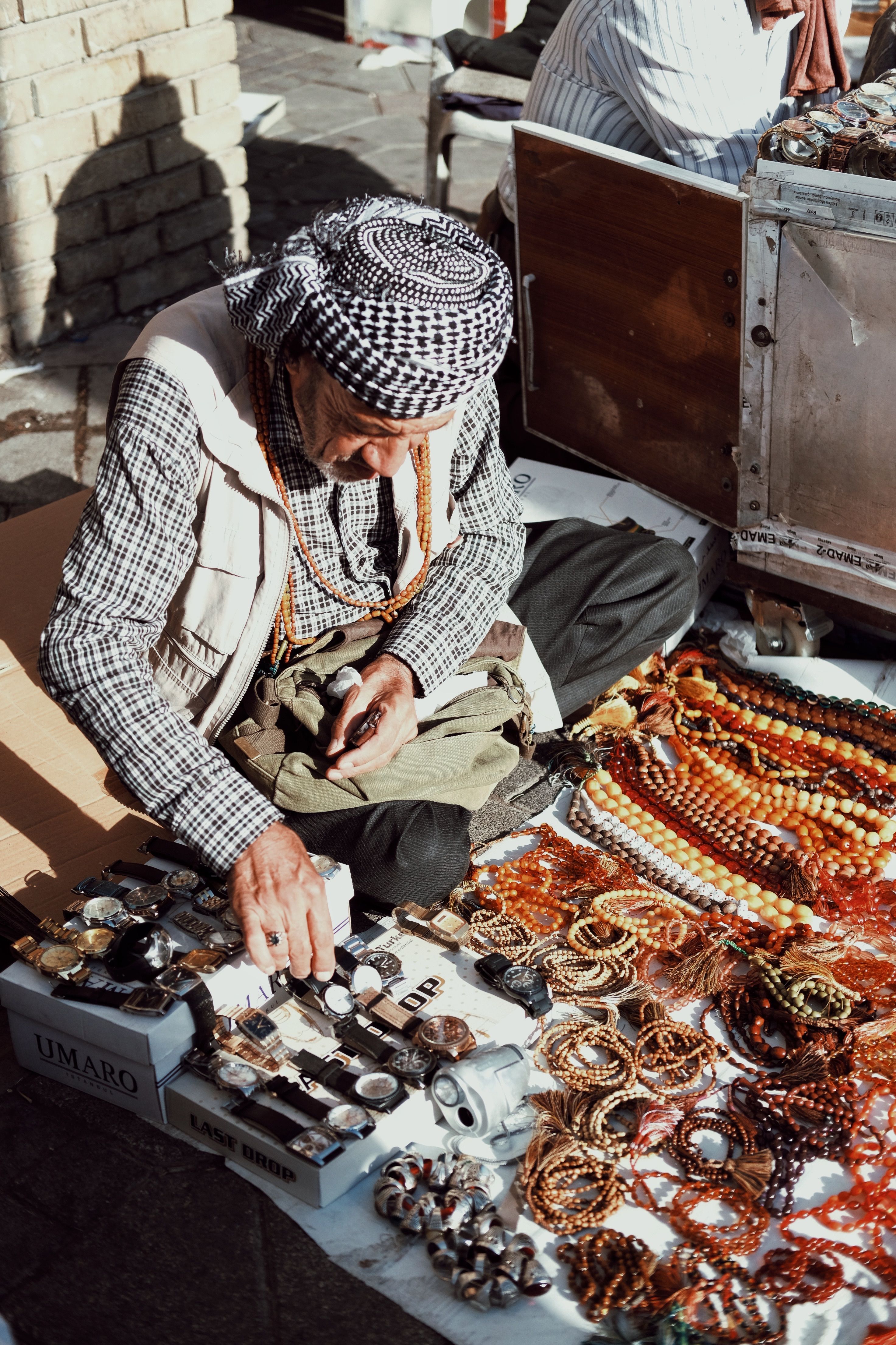 Elderly Man Selling Accessories on the Street · Free Stock Photo