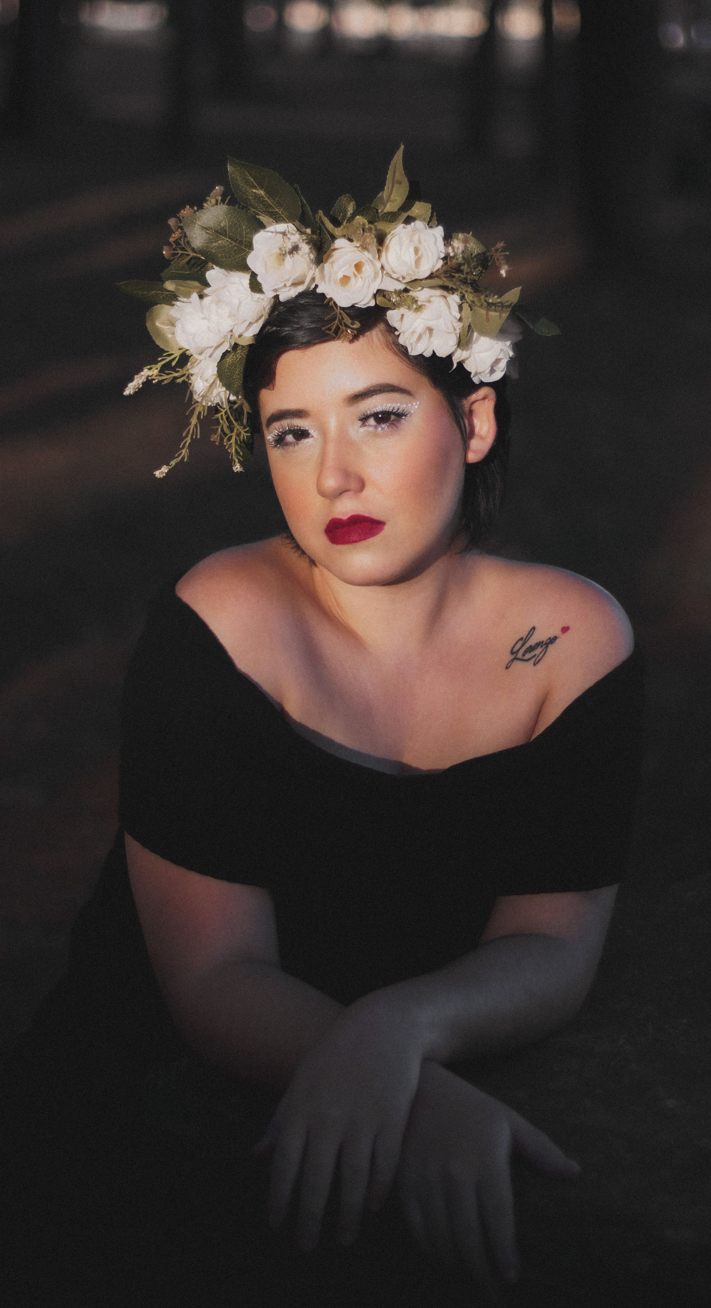 A Woman with Flower and Band Aid on Her Palm · Free Stock Photo