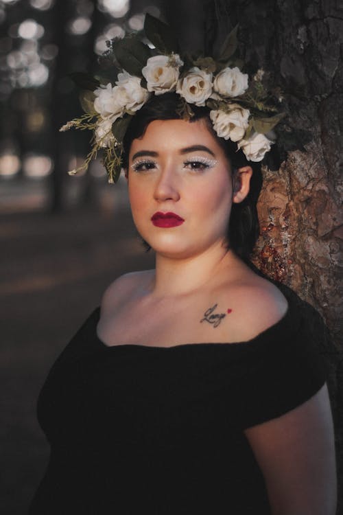 Woman In Black Off Shoulder Top Standing Beside Brown Tree · Free Stock