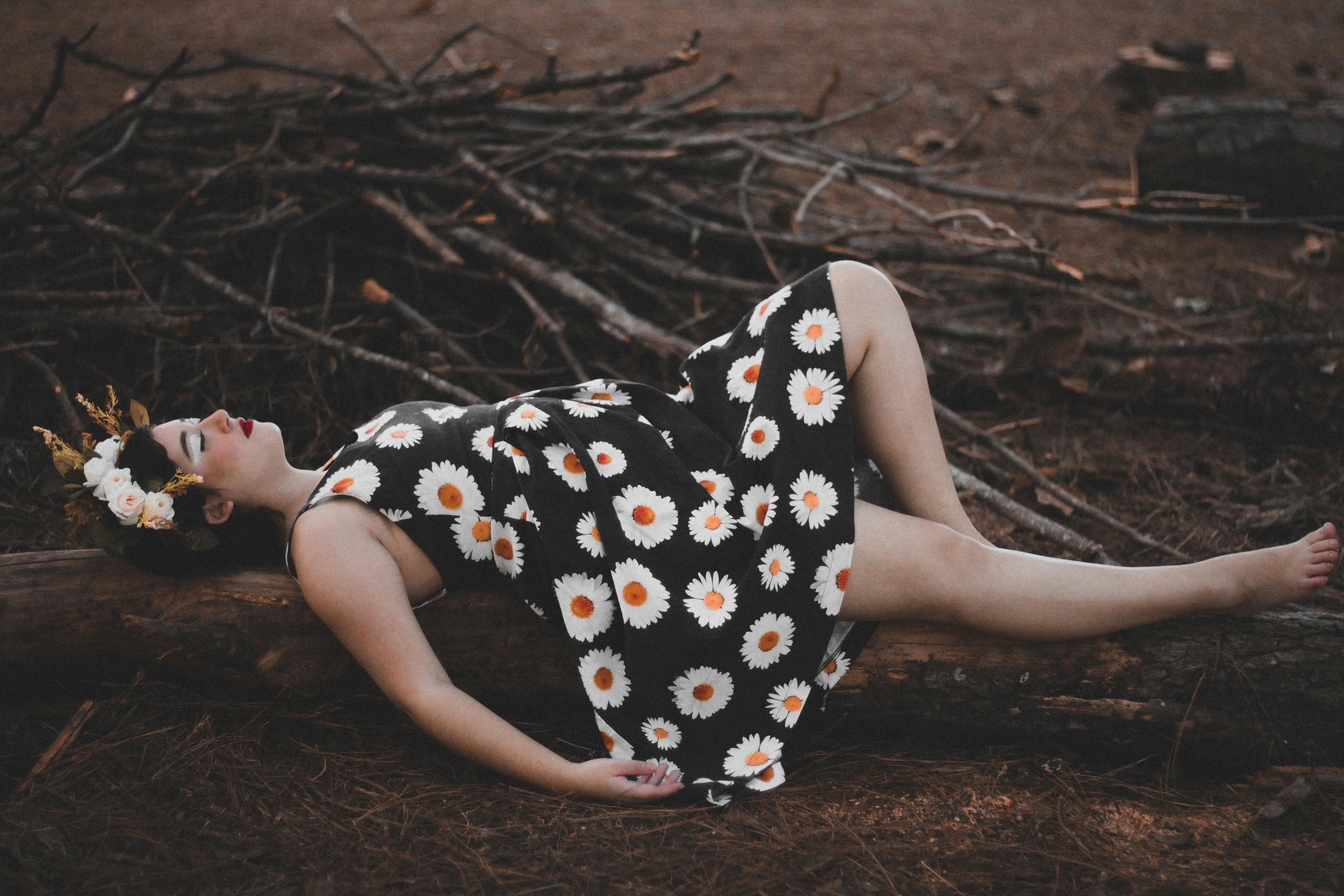 A Woman Lying on the Tree Log · Free Stock Photo