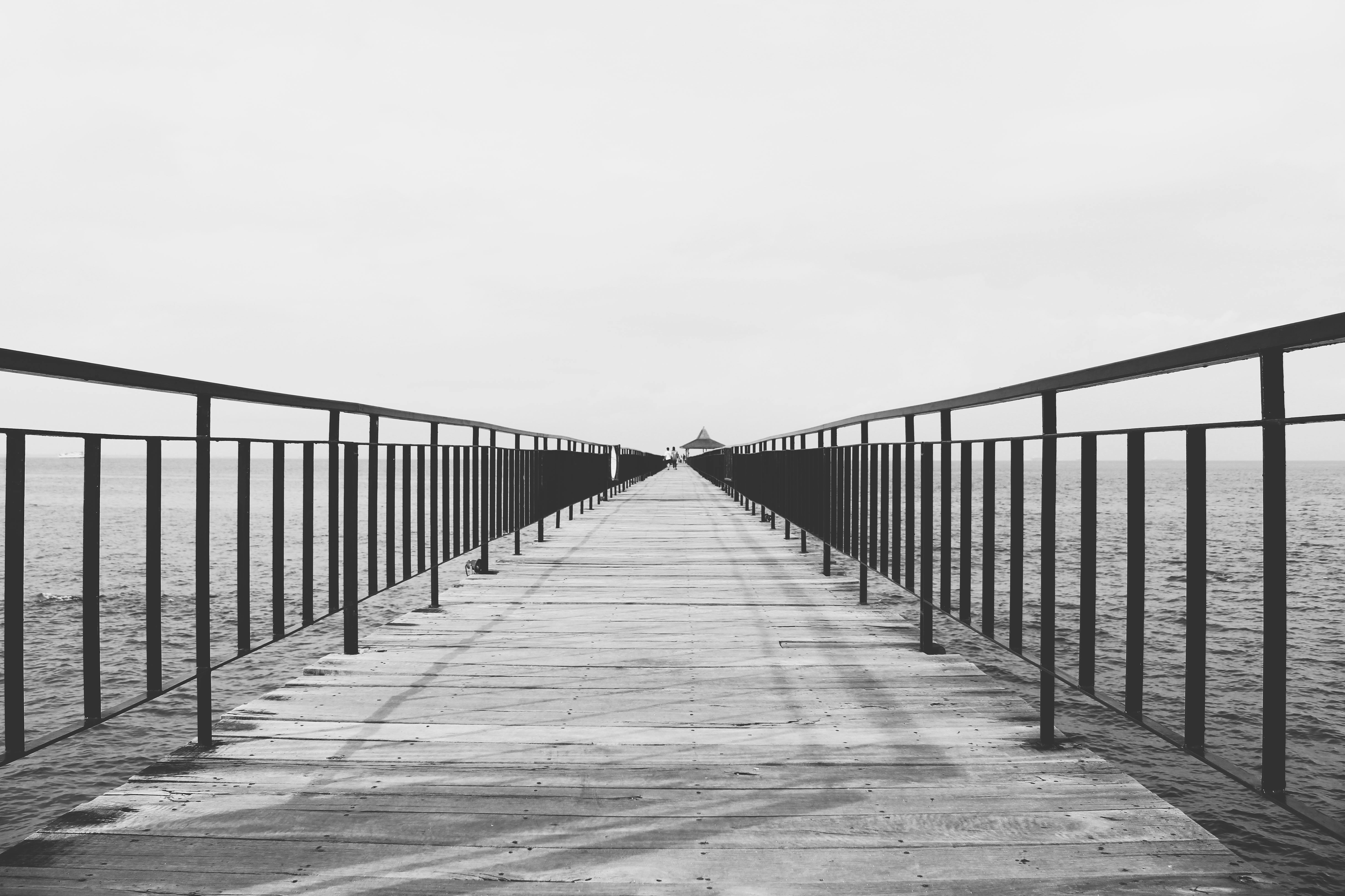 Grayscale Photo of Wooden Bridge · Free Stock Photo
