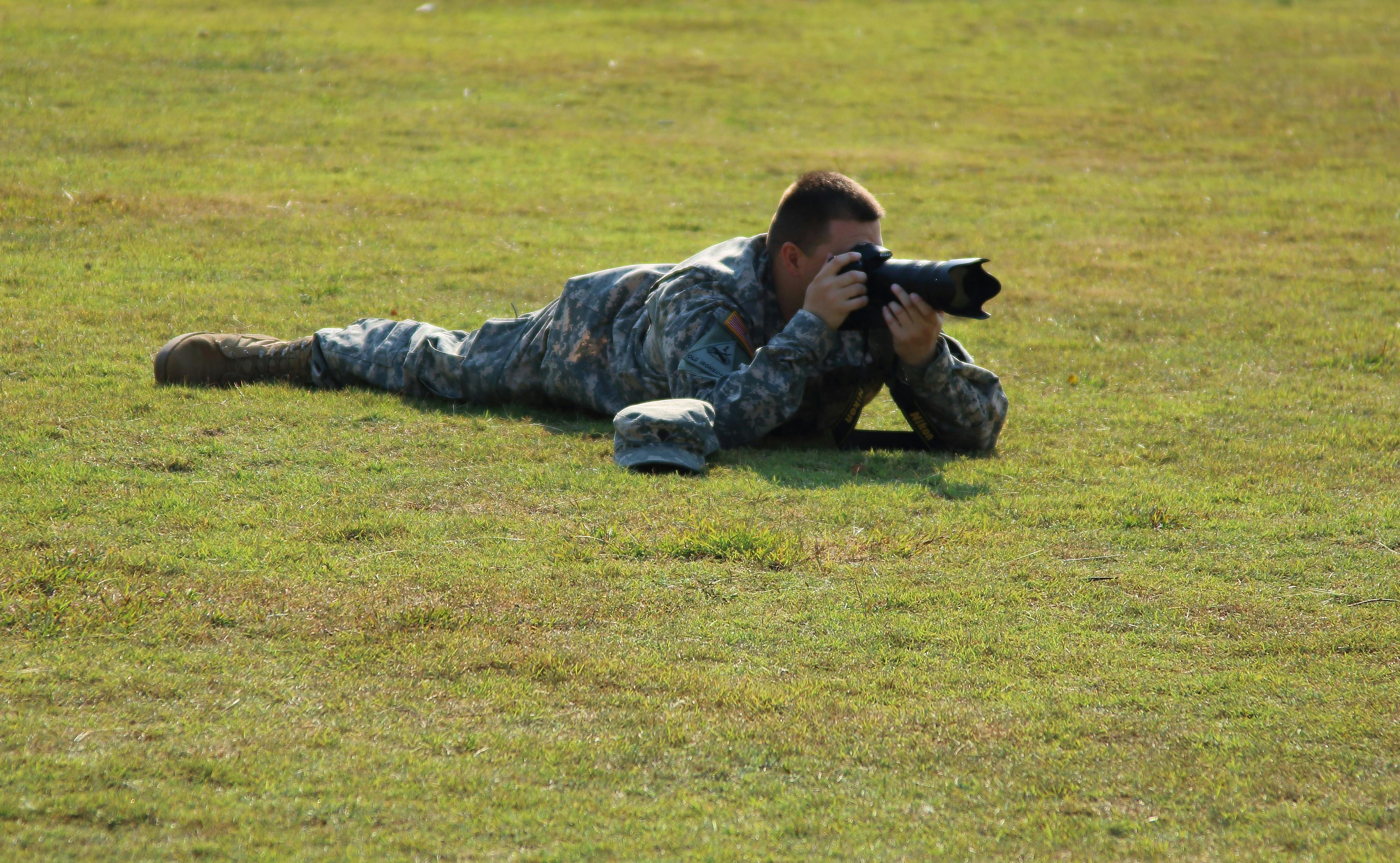 Military Crouching on Green Grass Using Dslr Camera during Daytime ...