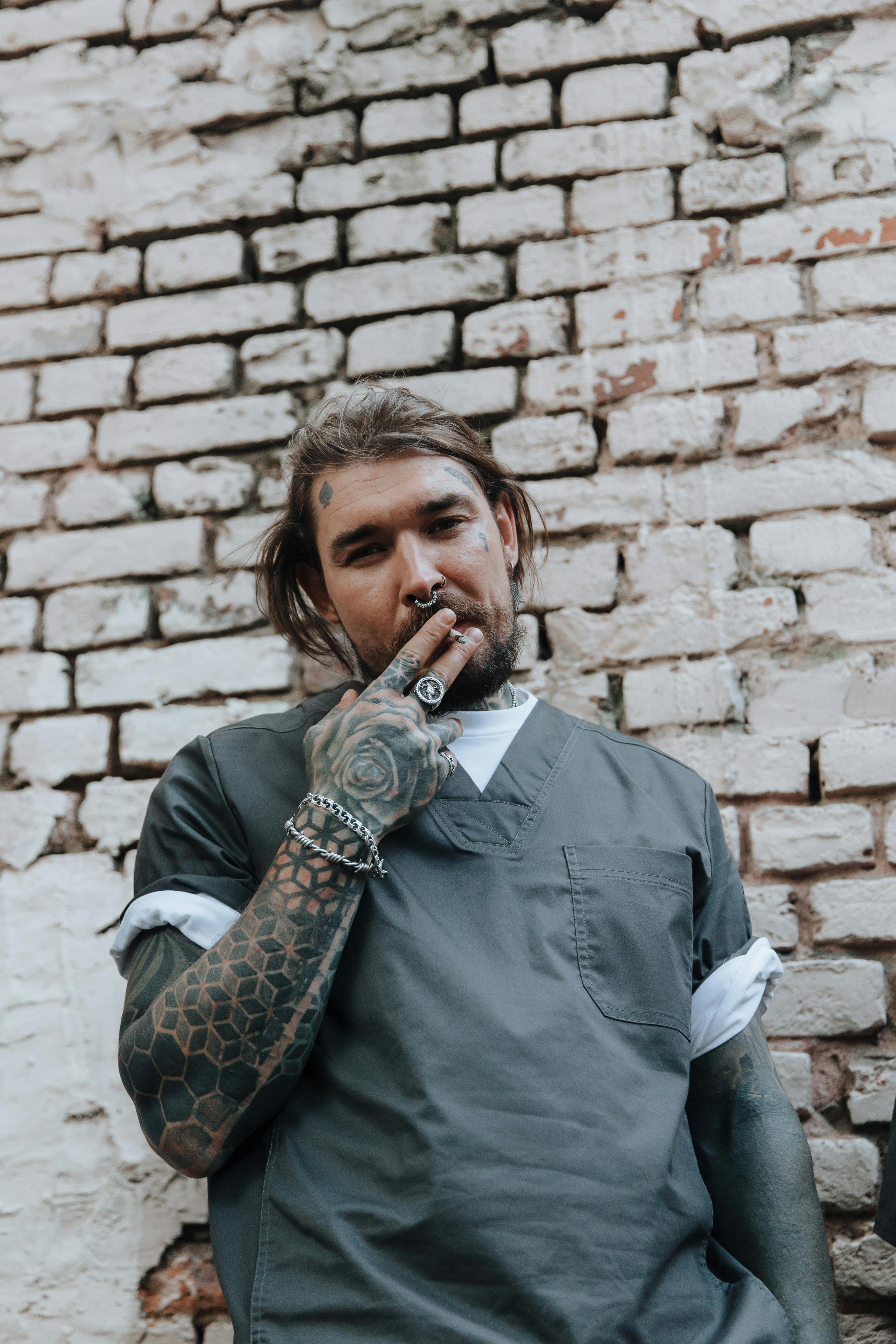 Man Standing and Smoking · Free Stock Photo