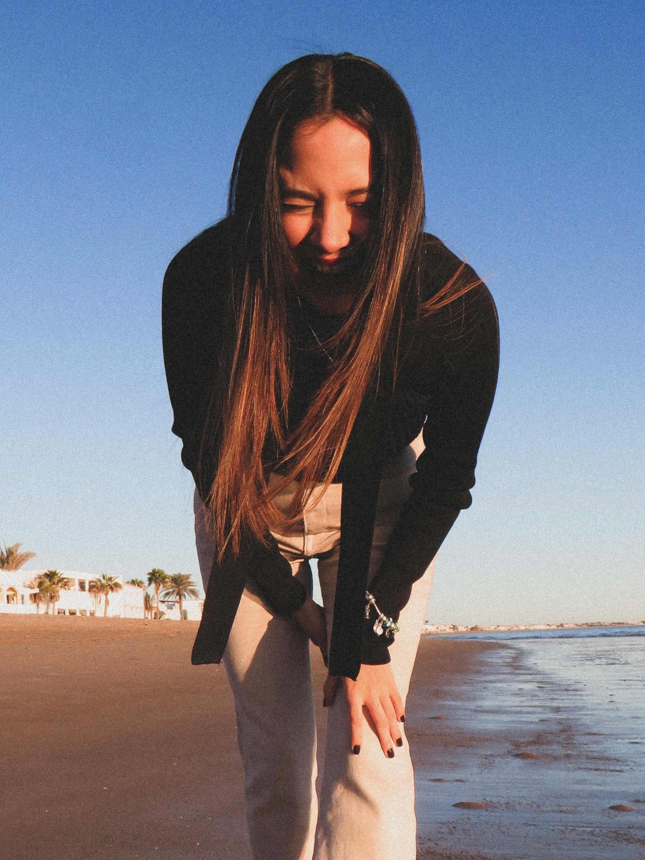 Woman Laughing at the Beach · Free Stock Photo