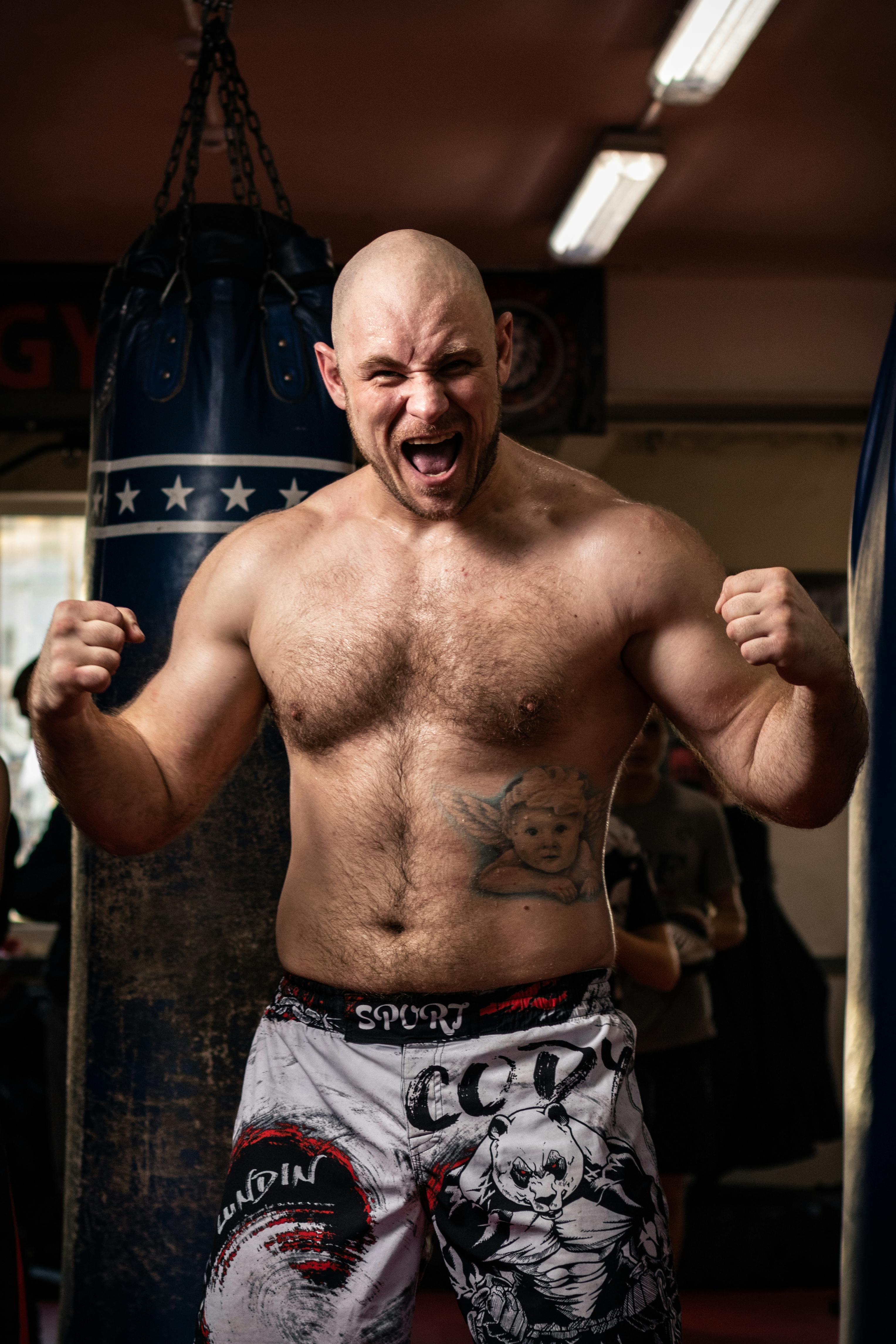 Shirtless Muscular Man in Sunglasses Posing at Boxing Ring · Free Stock ...