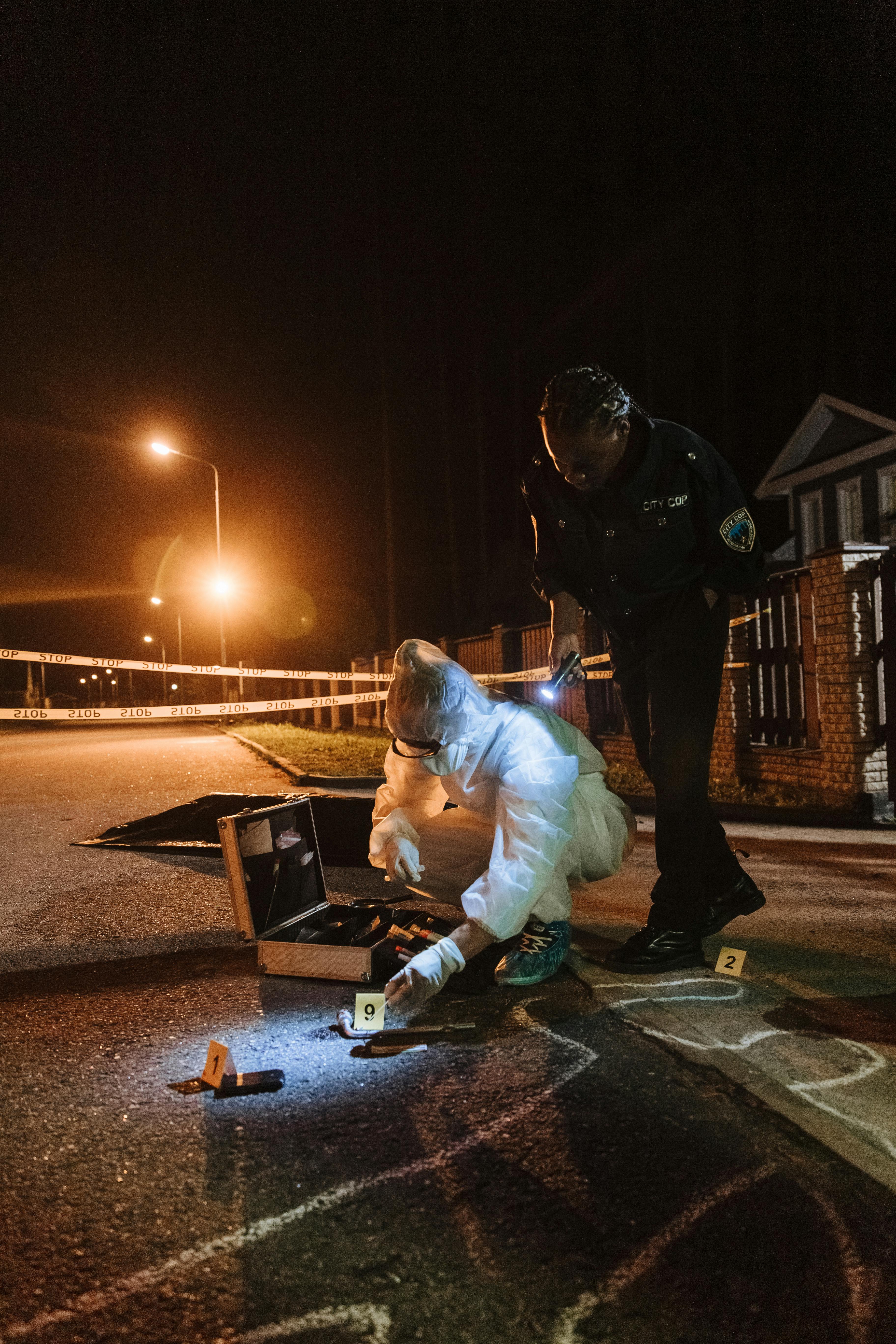 A Police Officer and Investigator on Crime Scene · Free Stock Photo