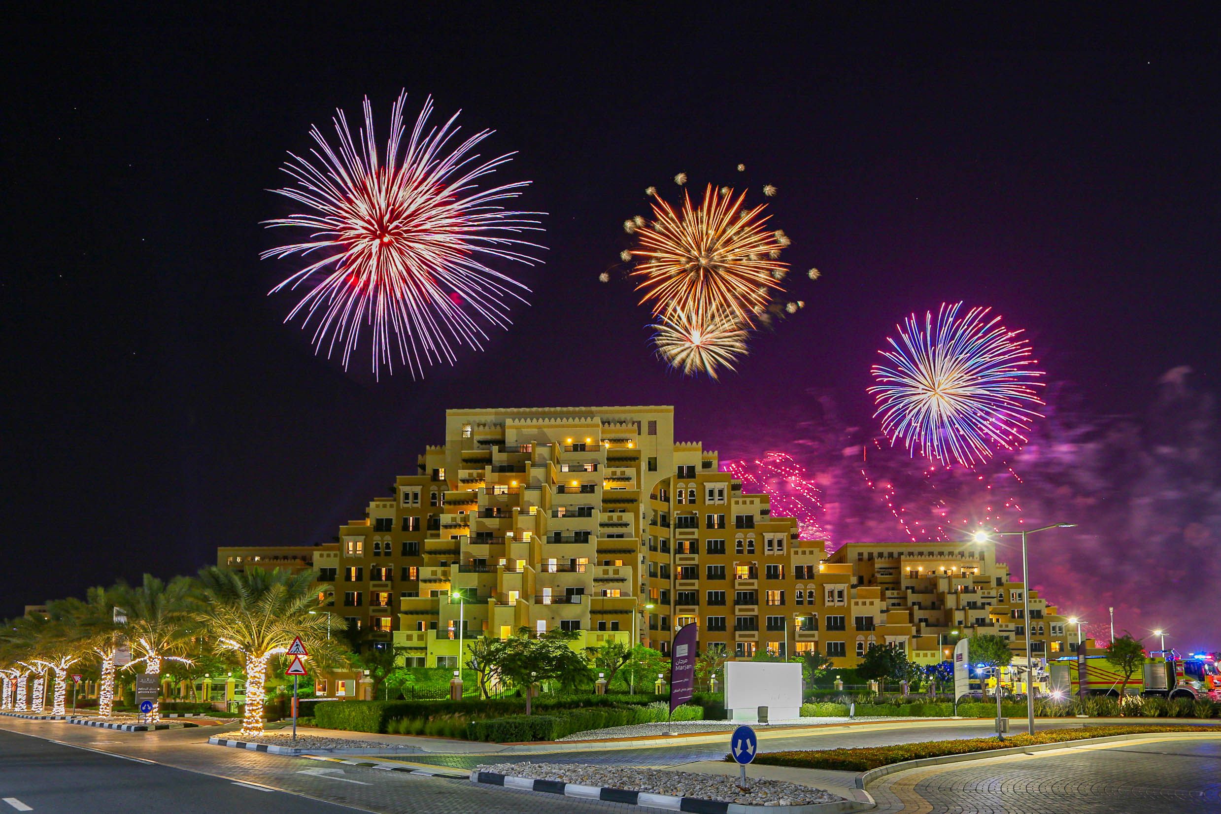 Fireworks Display Over the Concrete Buildings · Free Stock Photo