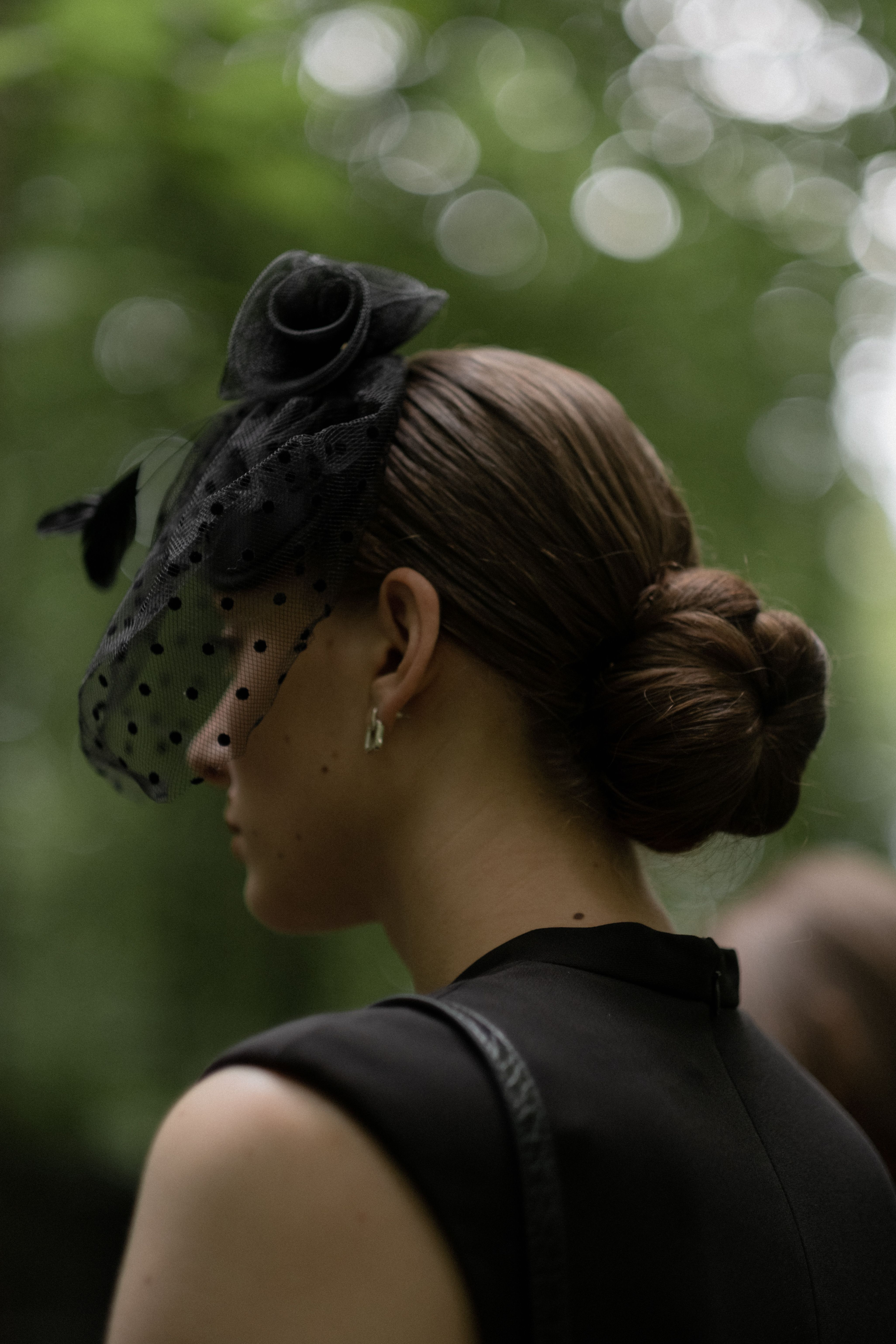 Back View of a Woman Tying Her Hair · Free Stock Photo