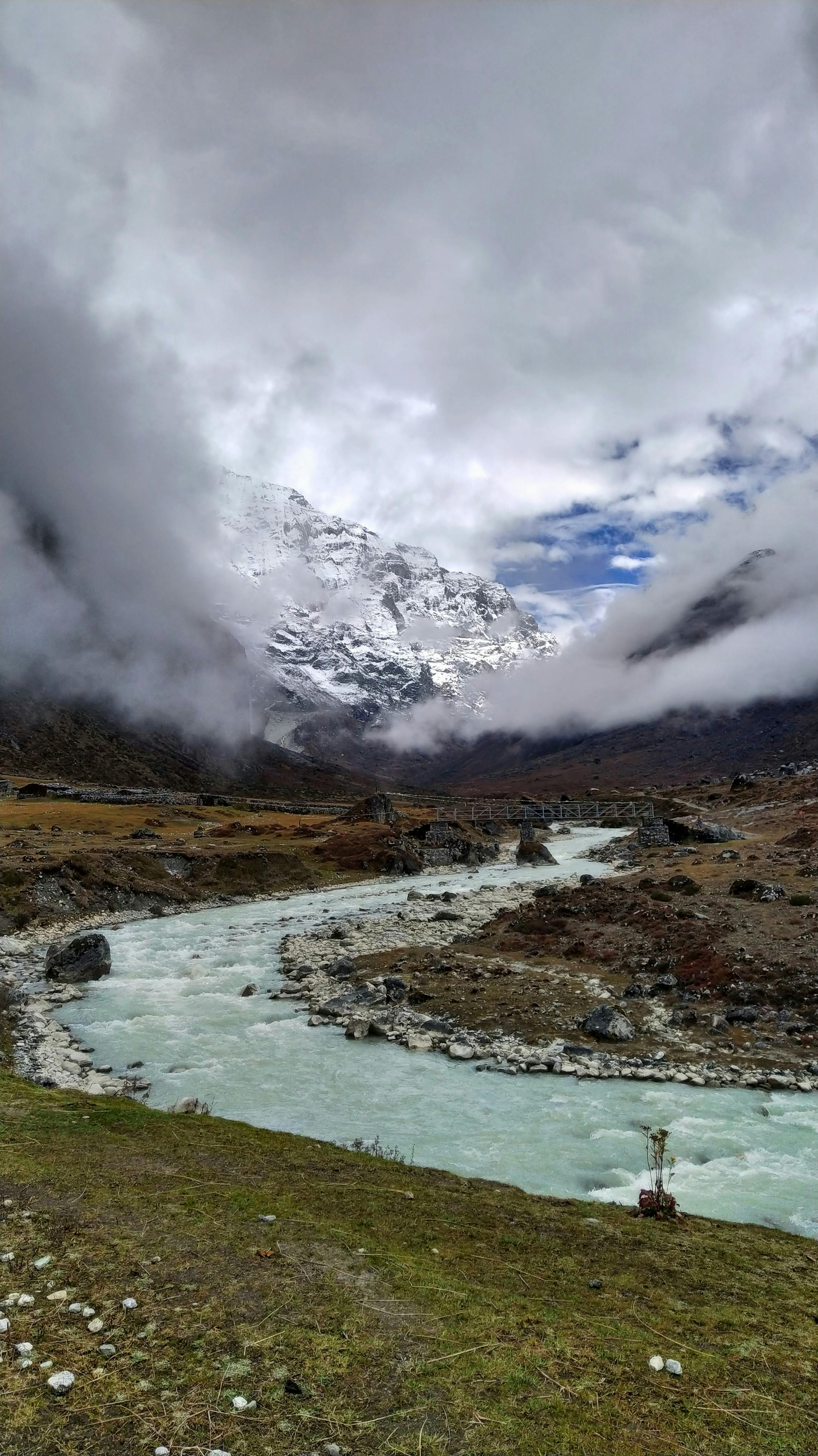 Snow Covered Mountain Near a River · Free Stock Photo