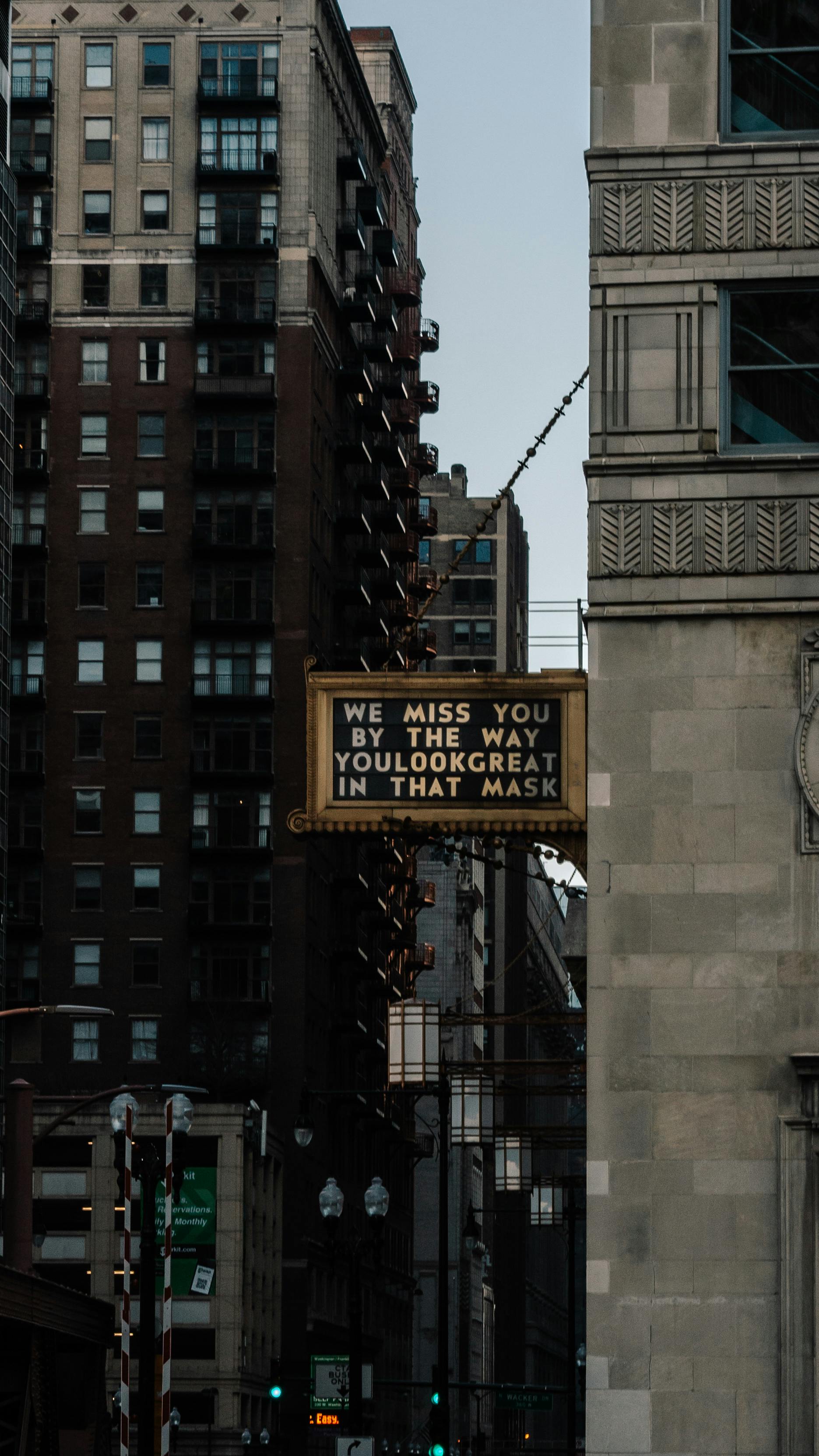 Illuminated Text Signage on the Building · Free Stock Photo