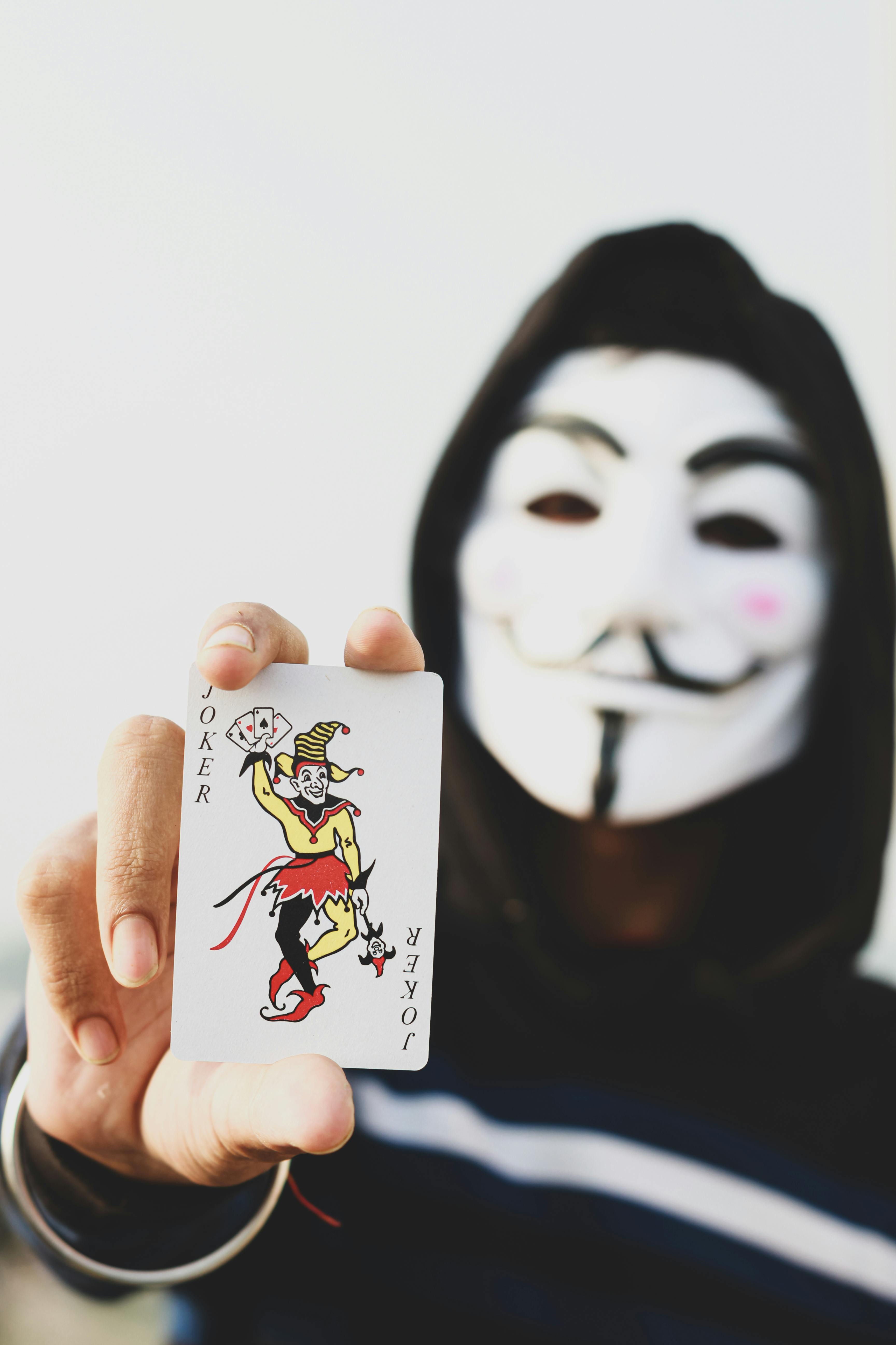 Hand Holding Joker Card · Free Stock Photo