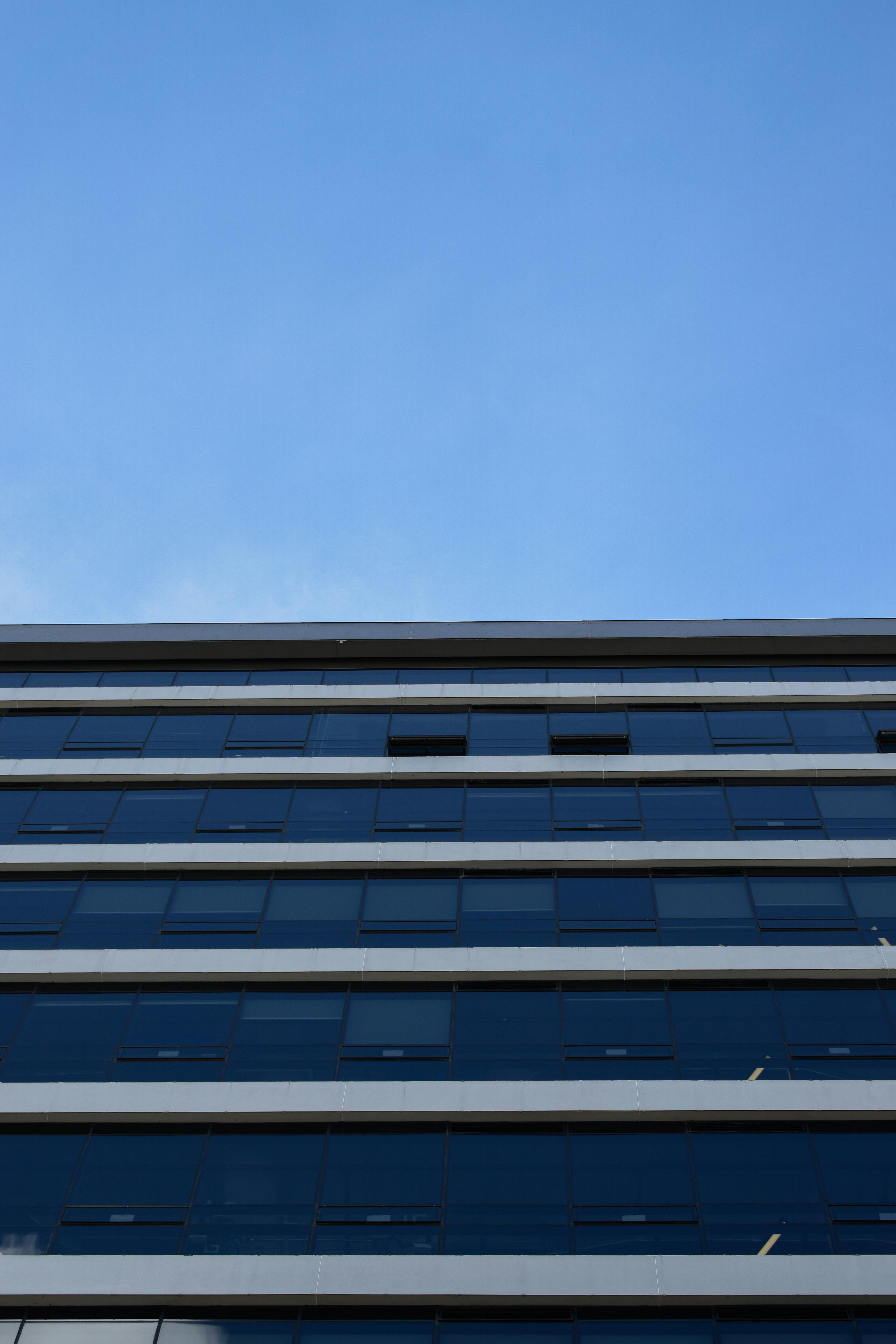 Glass Panels and Windows of a High Rise Building · Free Stock Photo