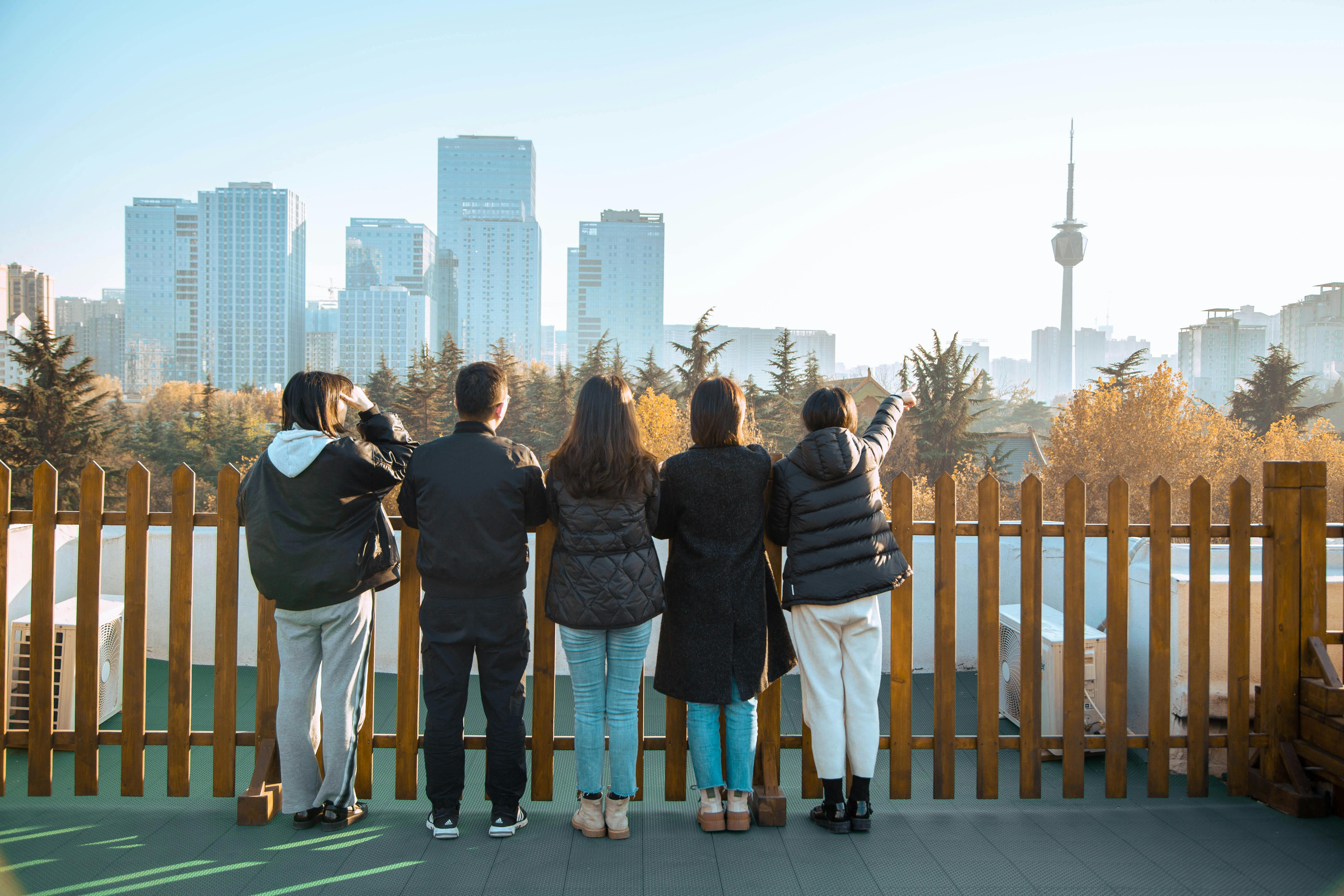 Back View of a People Looking the Buildings · Free Stock Photo