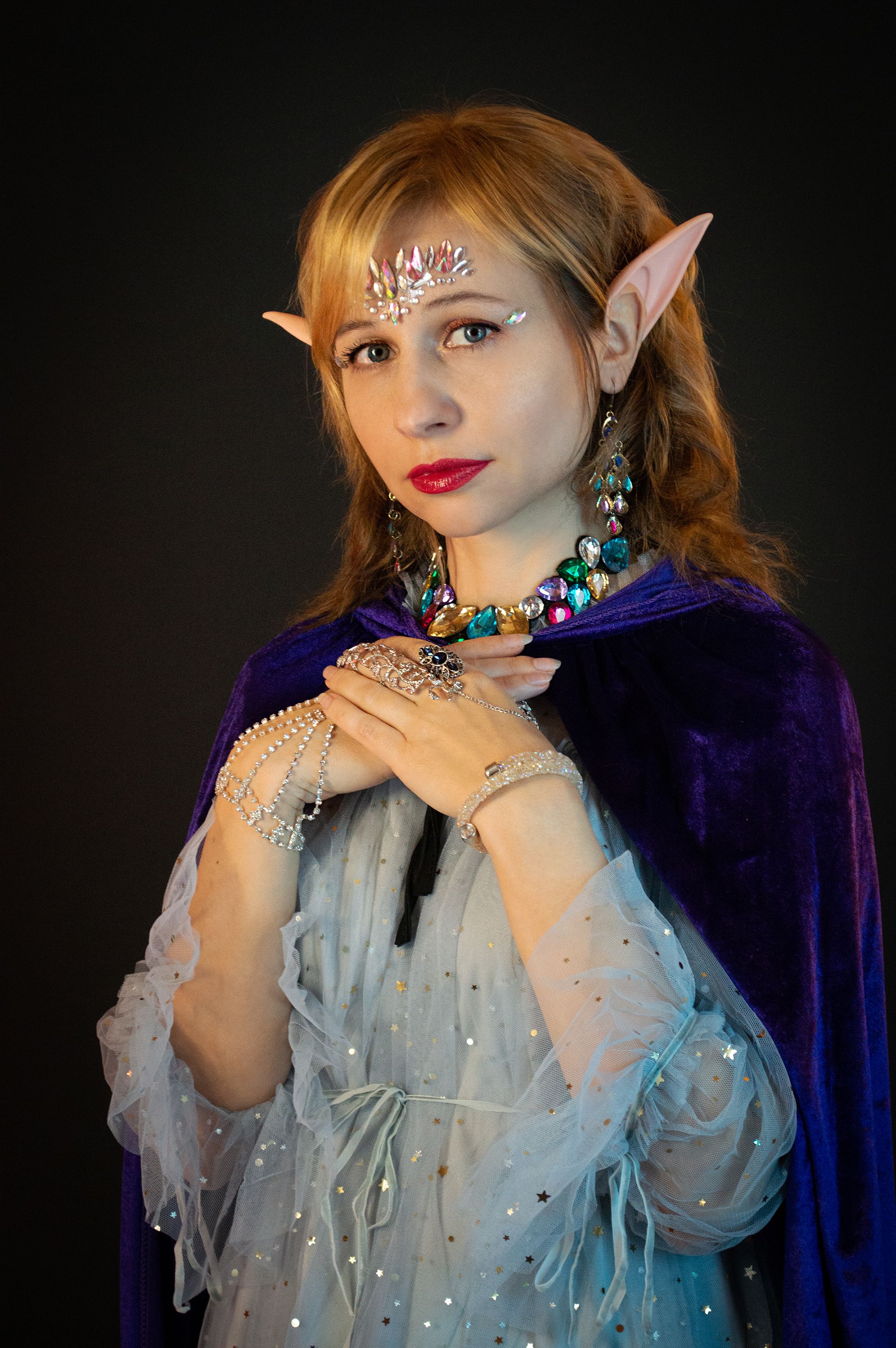 A Woman in Lilac and Black Dress Wearing Elf Ears · Free Stock Photo