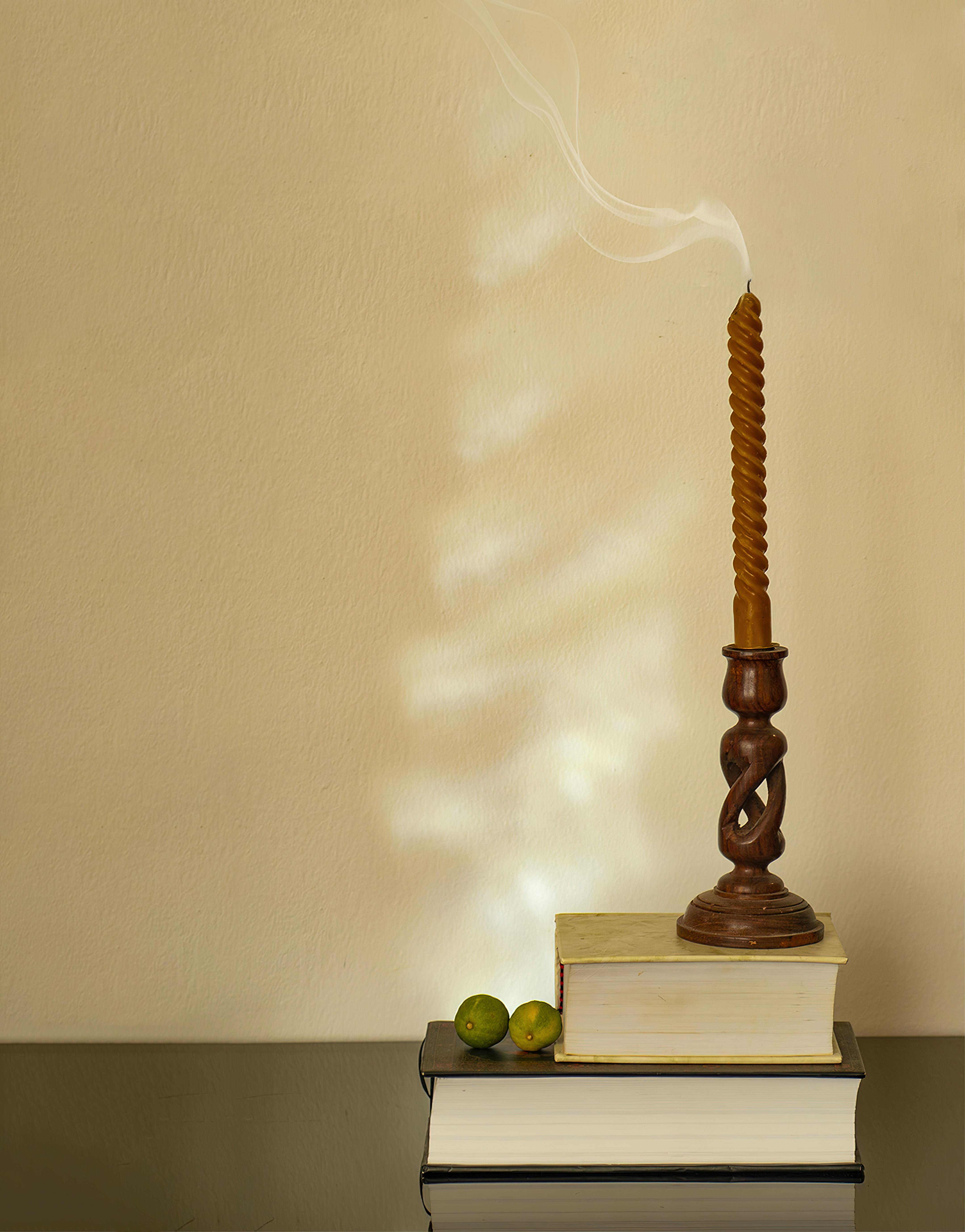Beige Books and Candle on a Windowsill · Free Stock Photo