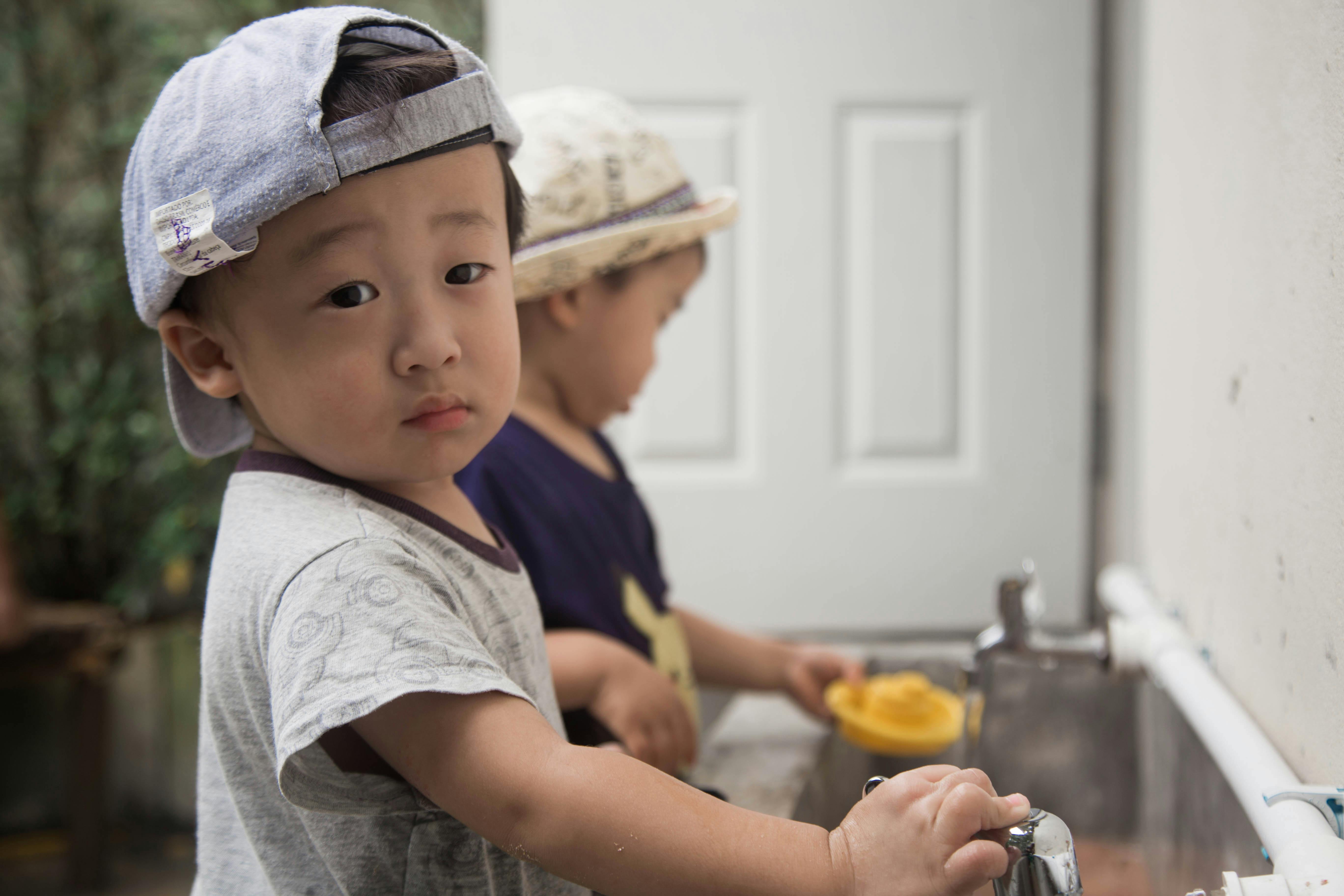 A Cute Boy Wearing a Cap · Free Stock Photo