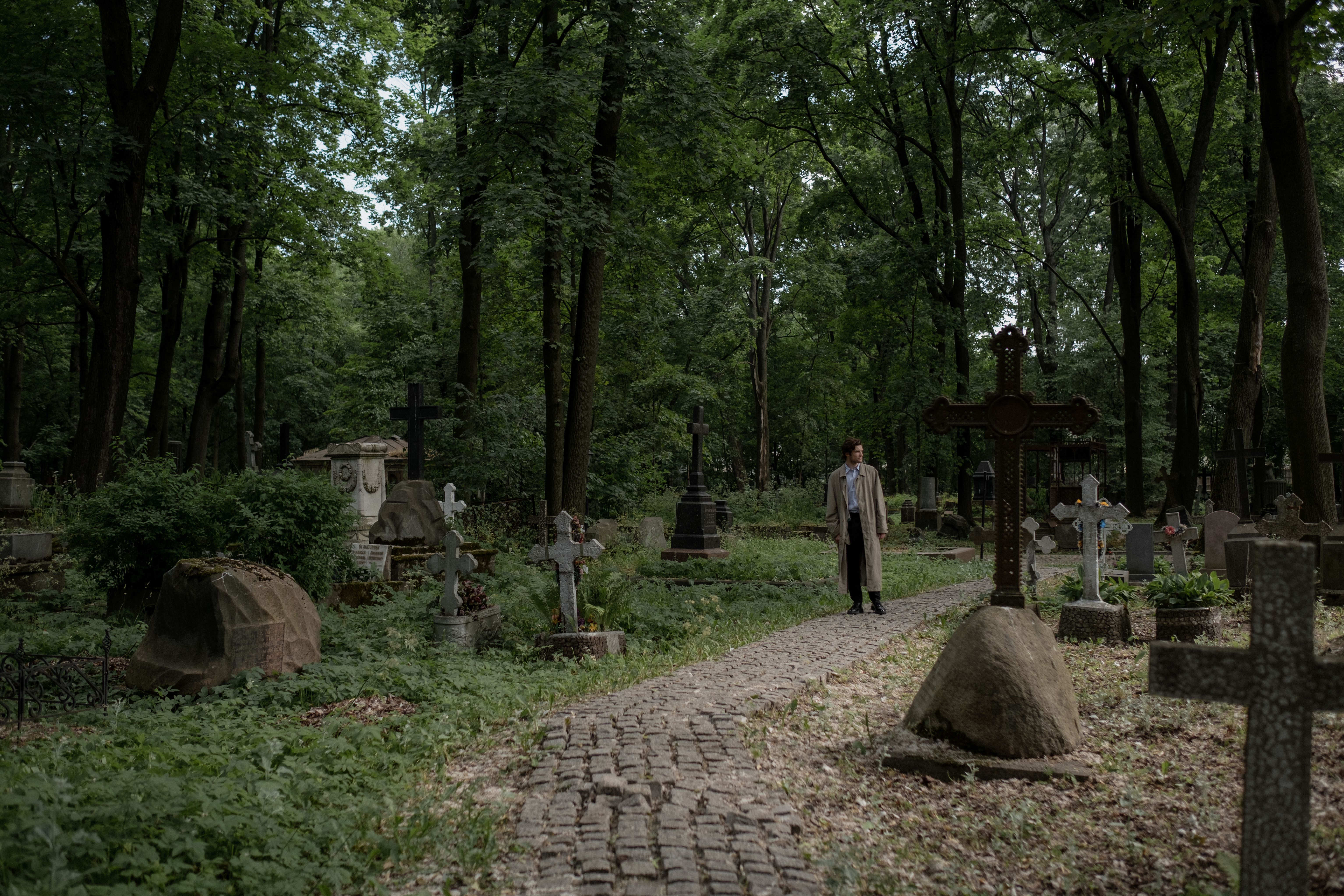 A Man Standing in a Graveyard · Free Stock Photo