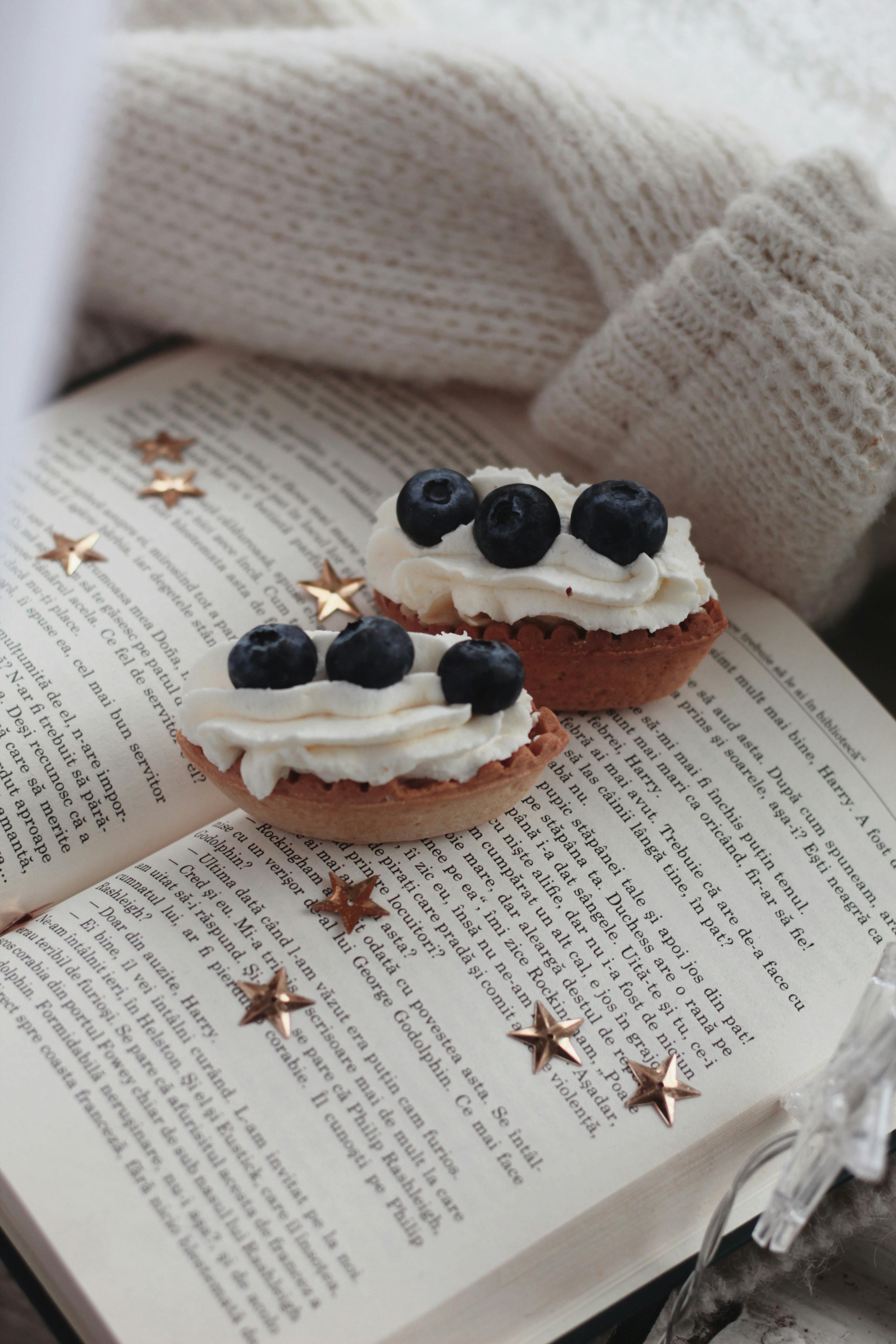 Christmas Cookies and an Open Book on a Window Sill · Free Stock Photo