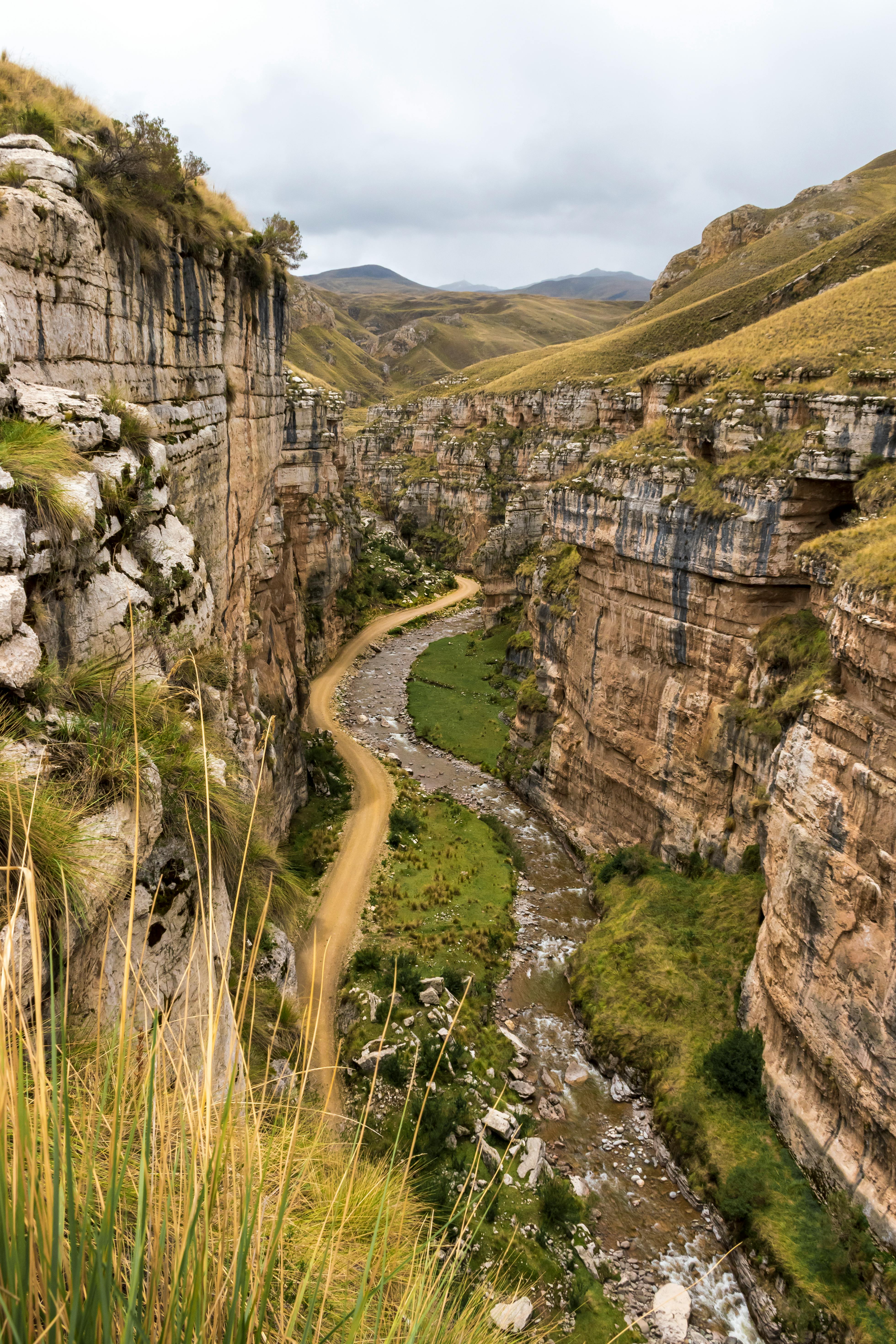 River in Between Mountains · Free Stock Photo