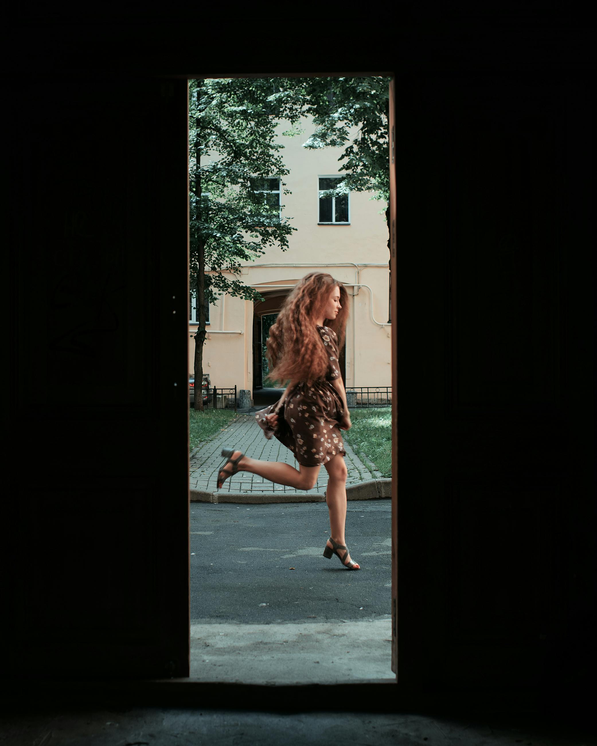 A Woman in High Heels Hopping · Free Stock Photo