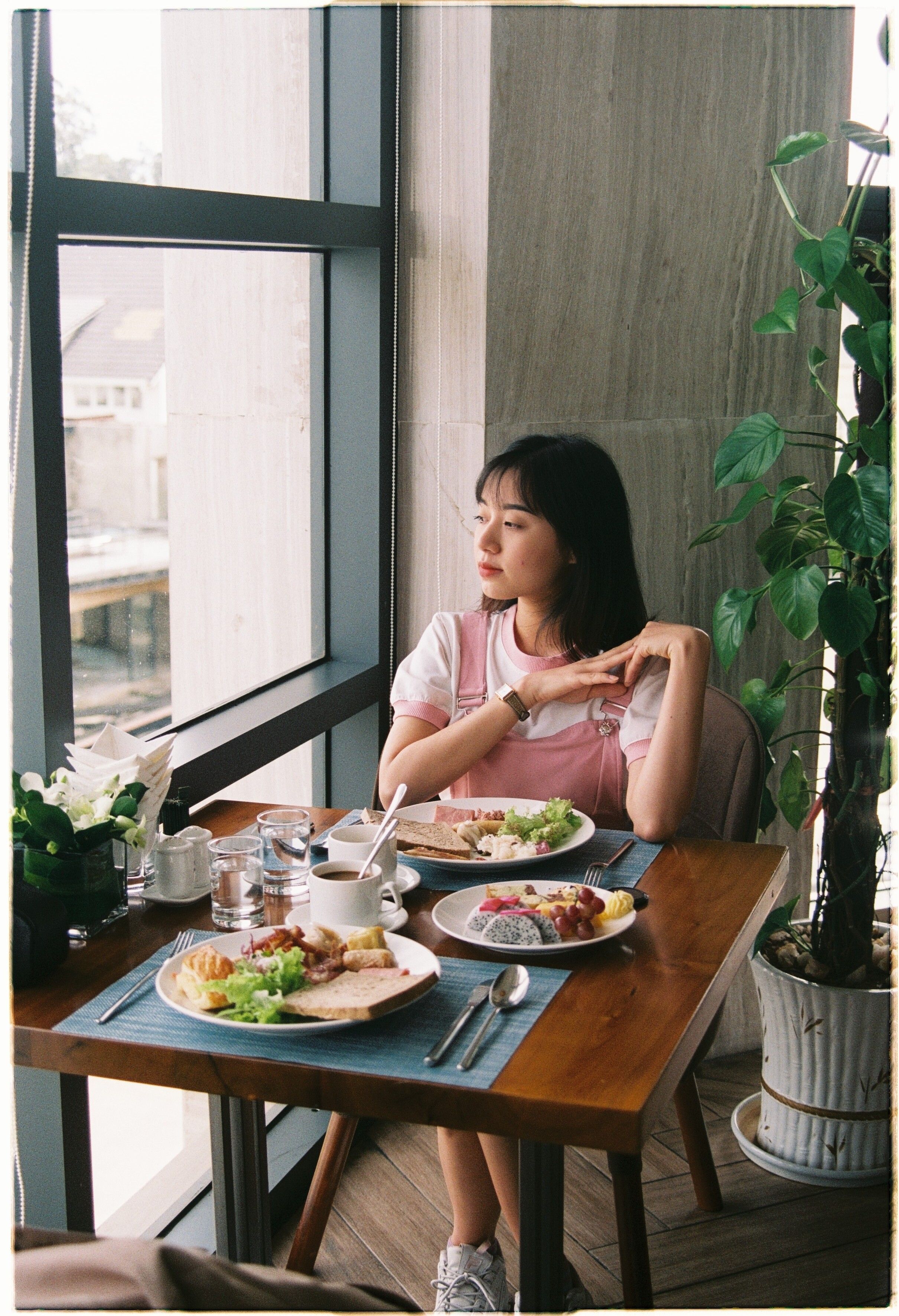 Woman Eating Breakfast in Cafe · Free Stock Photo