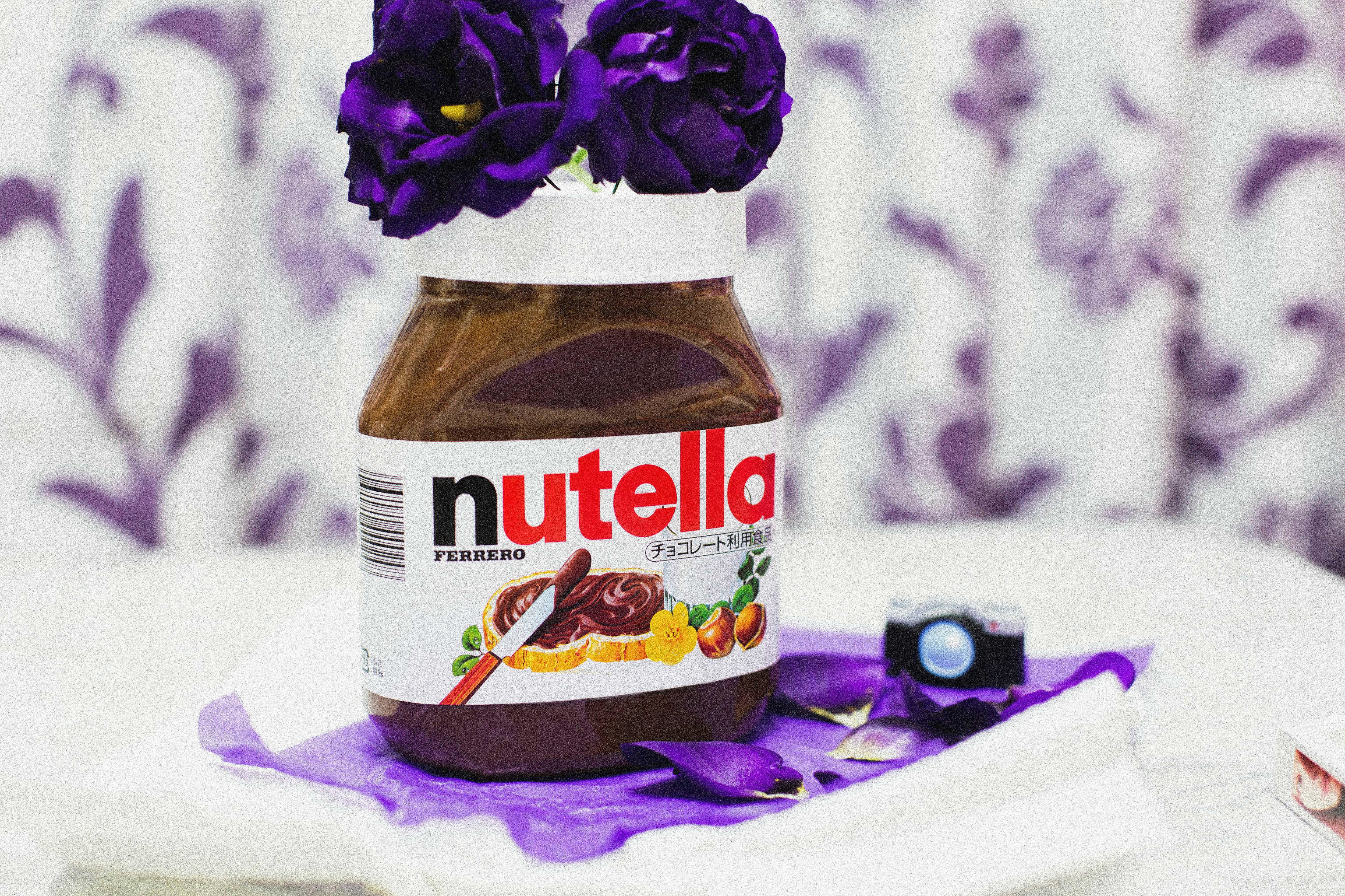 Purple Flowers on Top of the Nutella Jar · Free Stock Photo