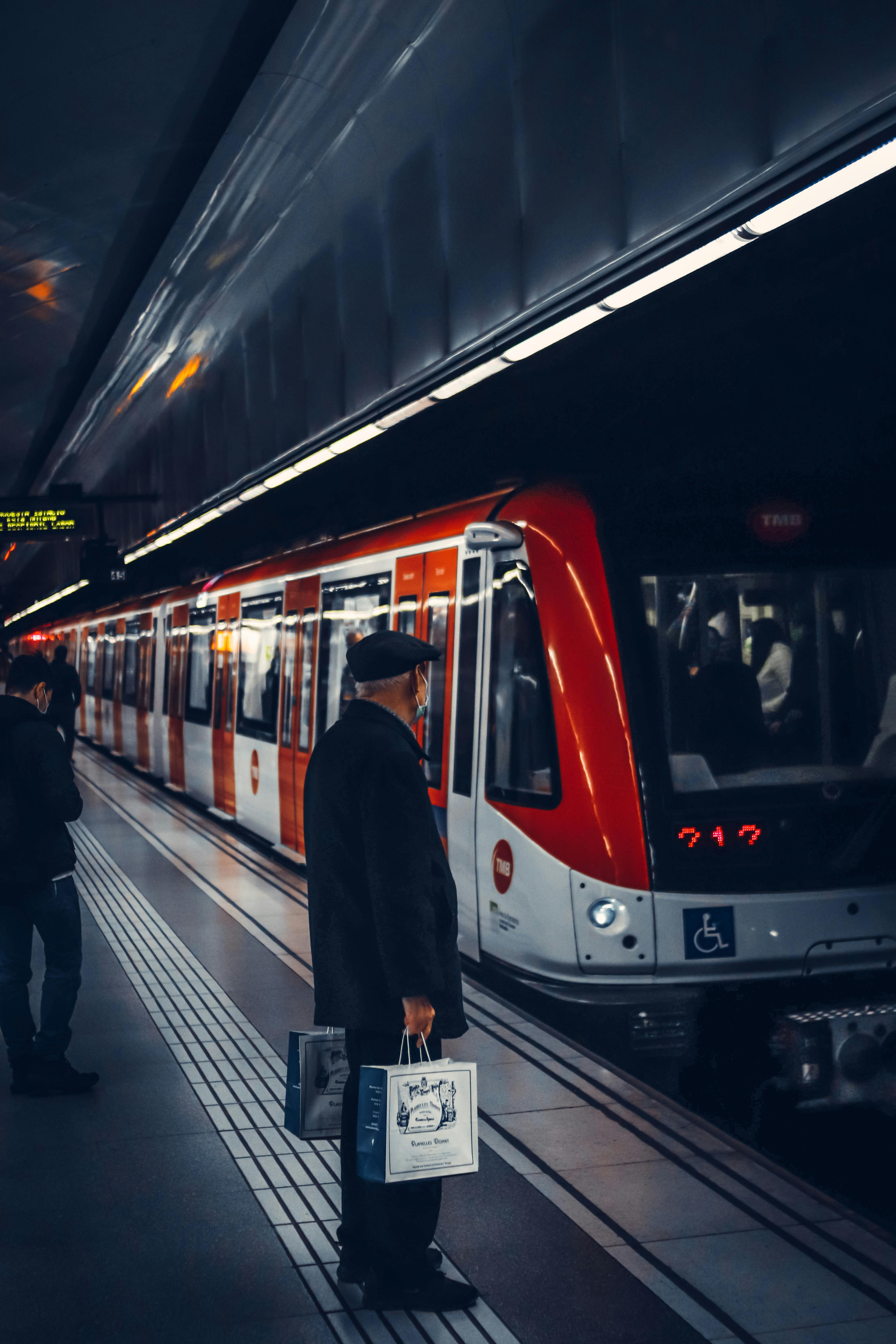 People Sitting Inside a Red Train · Free Stock Photo
