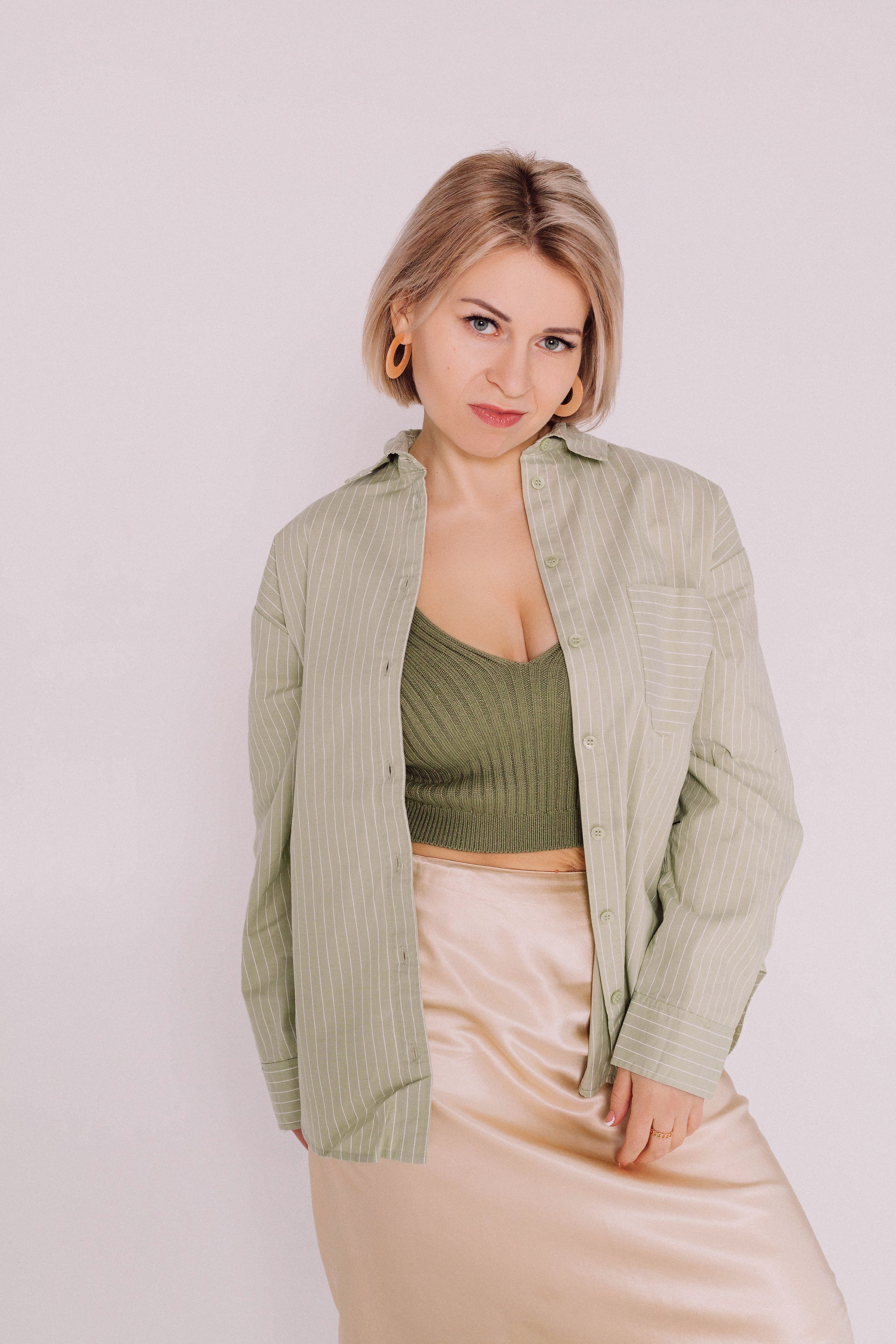 A Woman in Green Crop Top Under a Gray Unbuttoned Shirt · Free Stock Photo