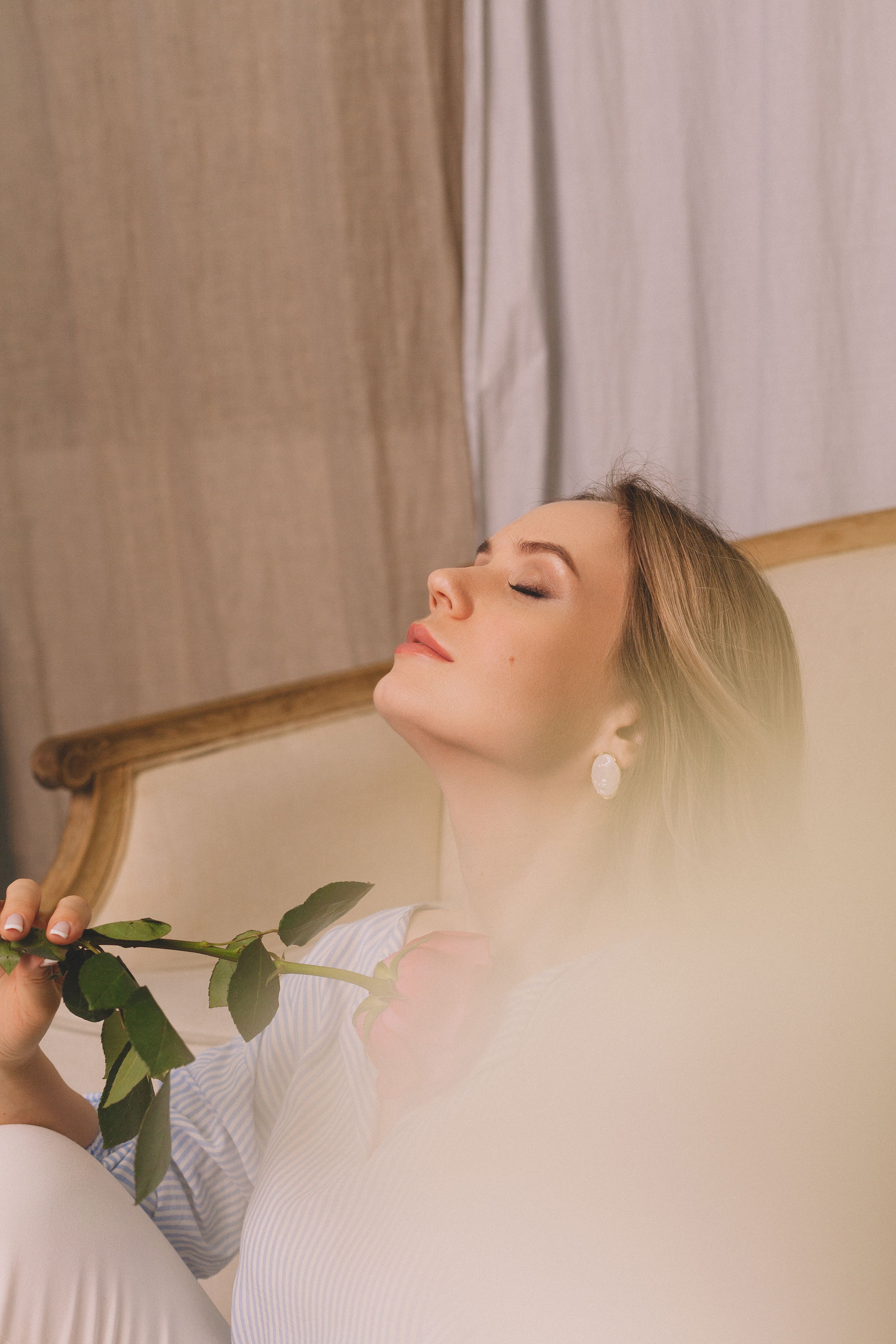 Blonde Woman Holding Twig · Free Stock Photo