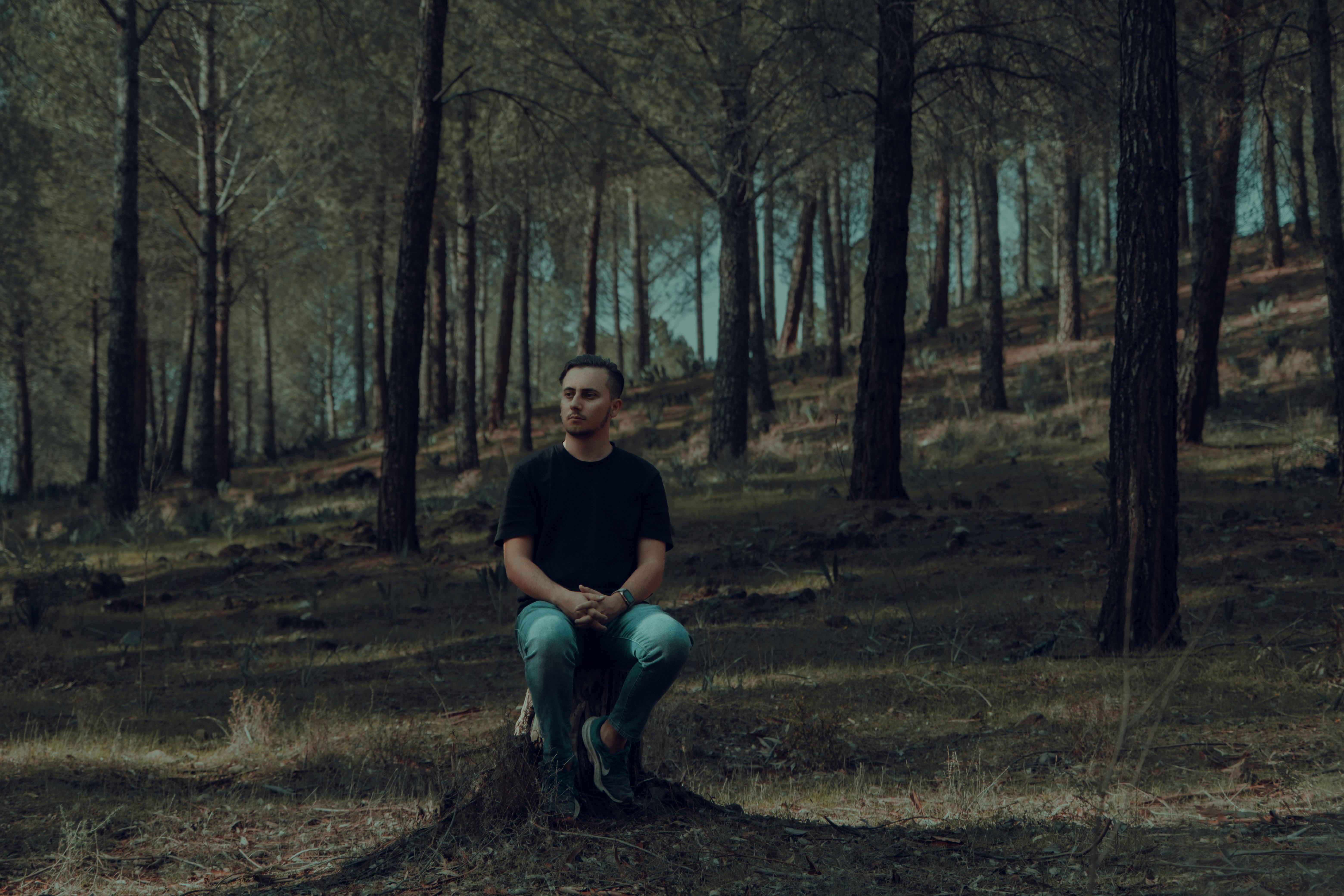 Man Sitting in Forest · Free Stock Photo