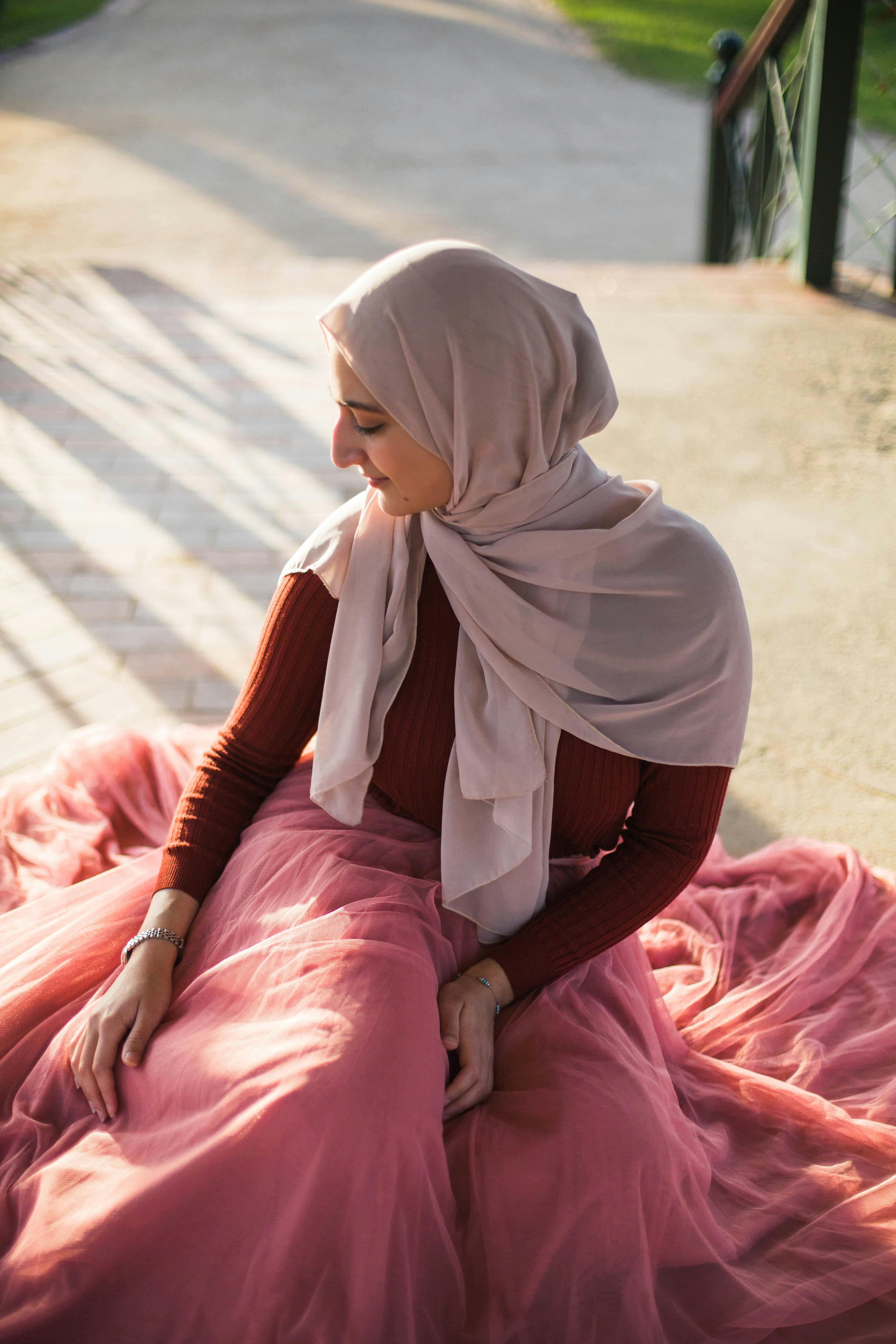 Women Wearing Hijabs Kneeling on Rugs · Free Stock Photo
